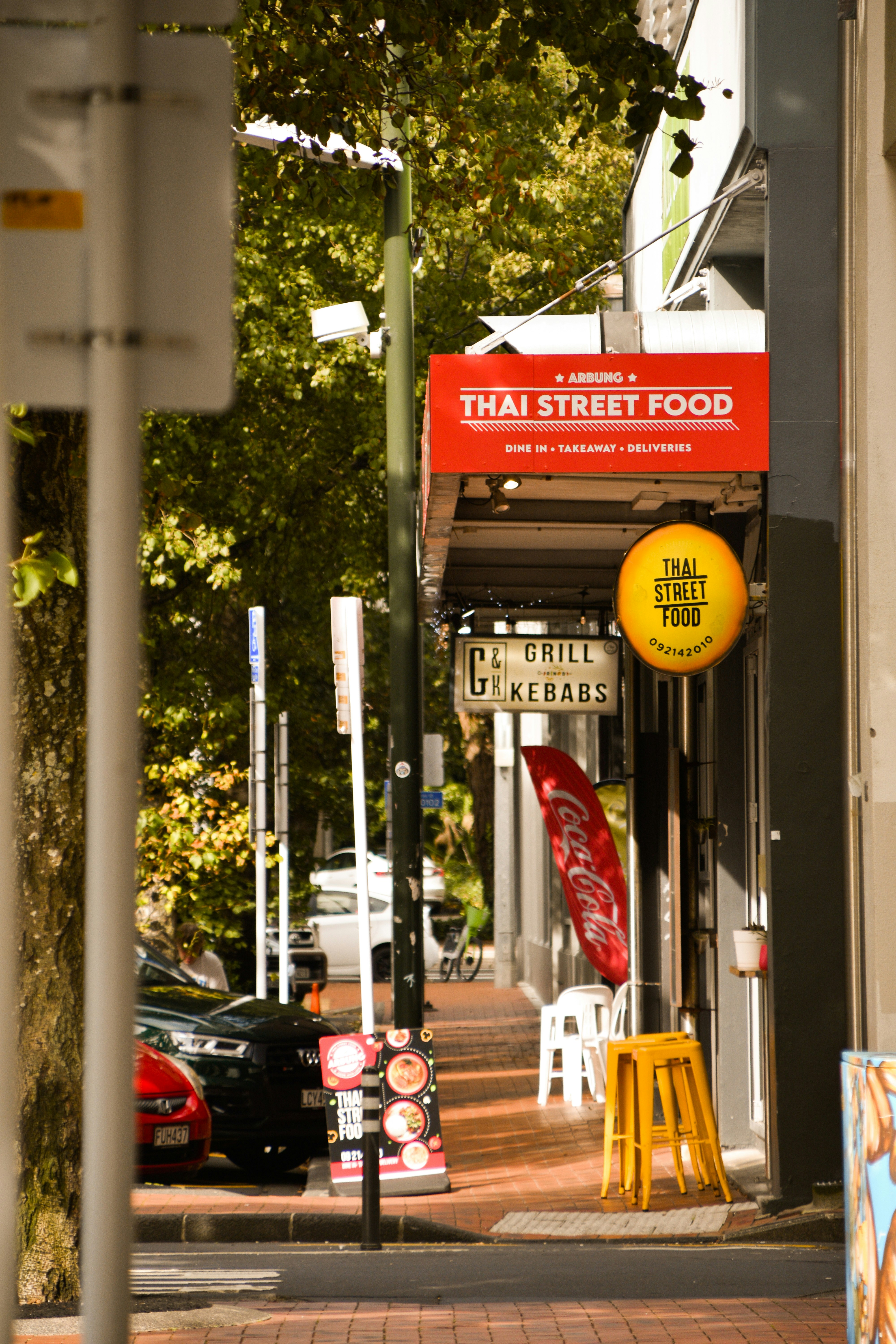 Street Bites: A Thai Food Corner Drenched in Afternoon Light