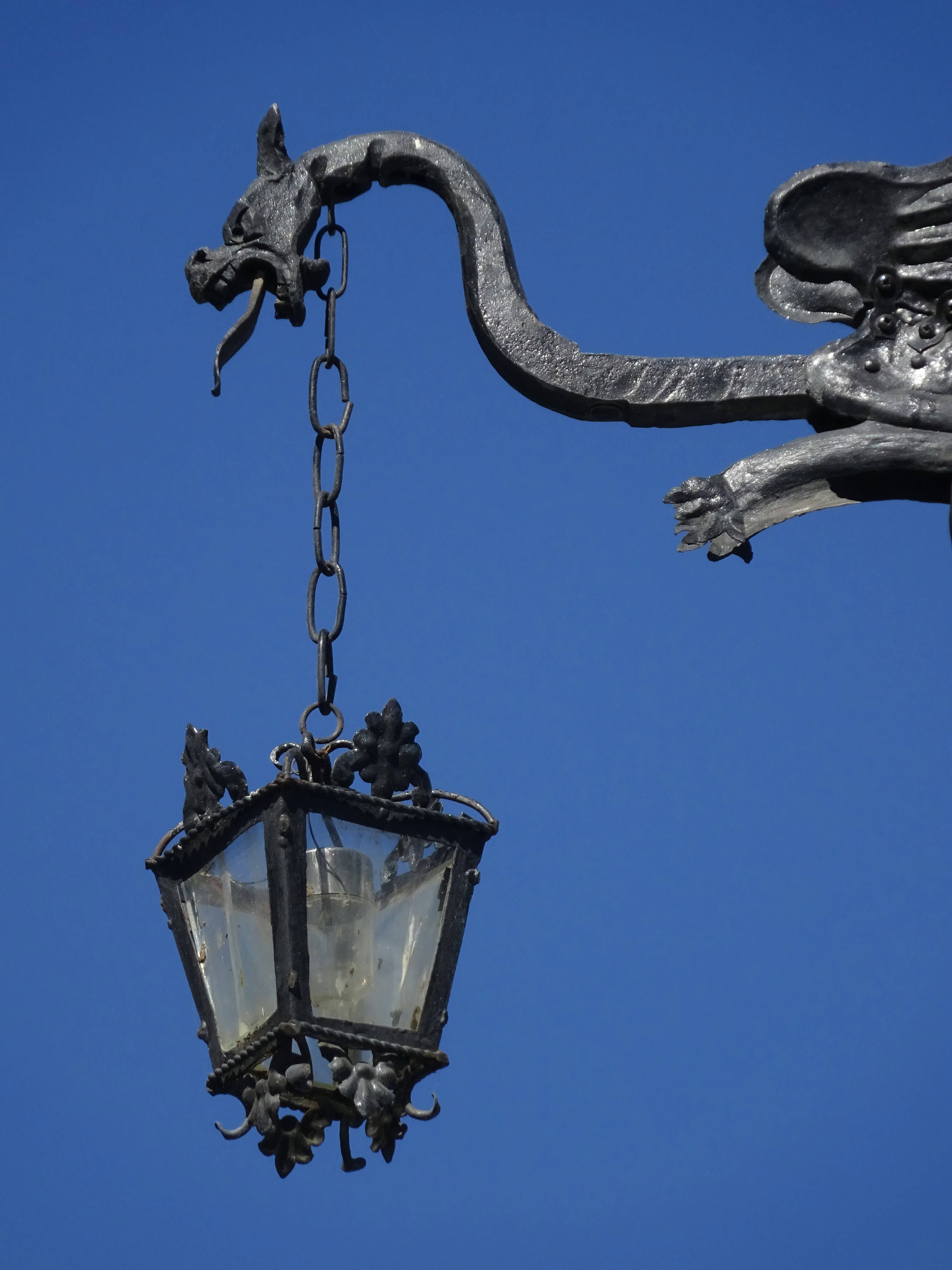 Iron Dragon Lantern Adrift Against a Pristine Cobalt Sky