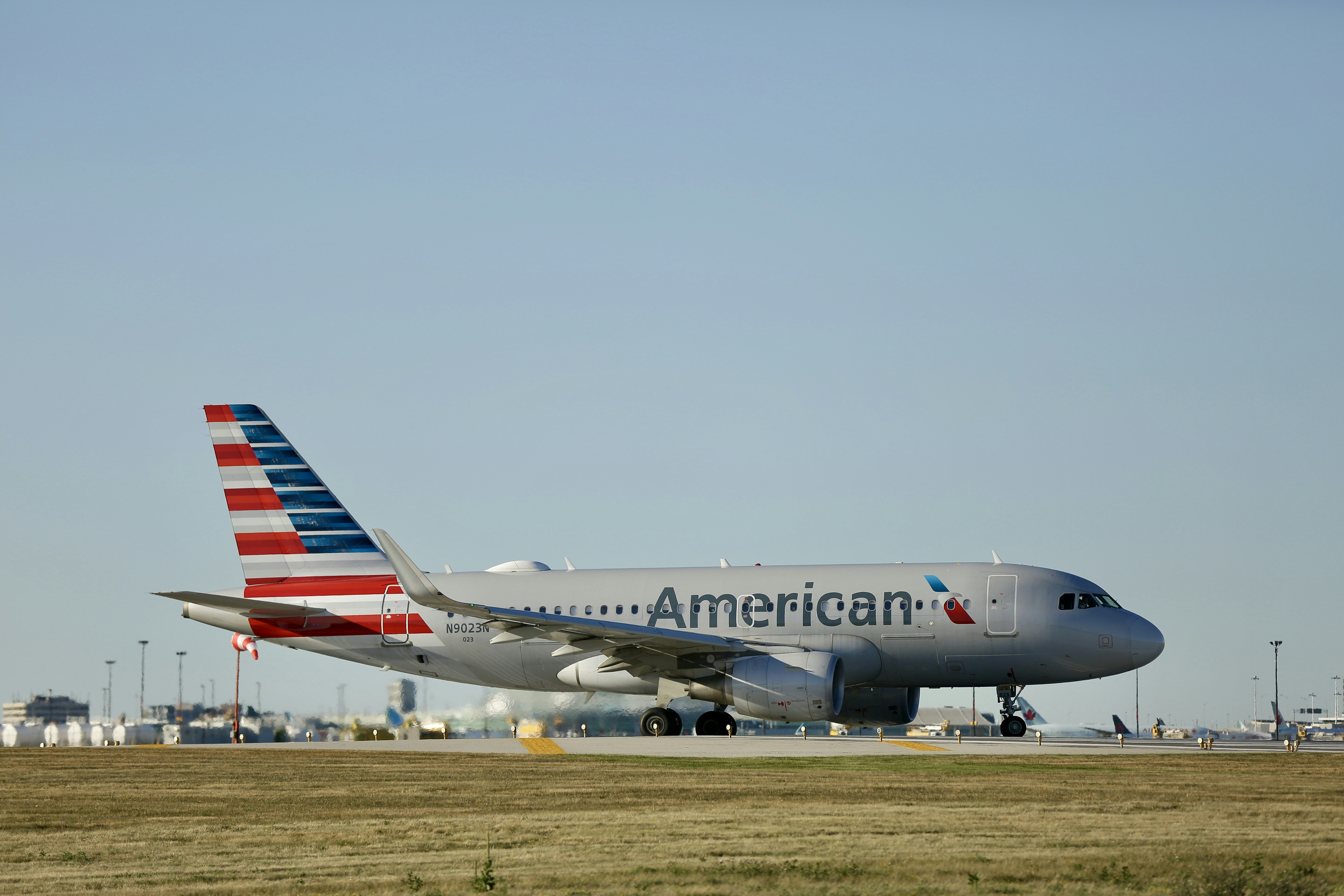 A large commercial airplane on a run way photo – Free Toronto pearson ...