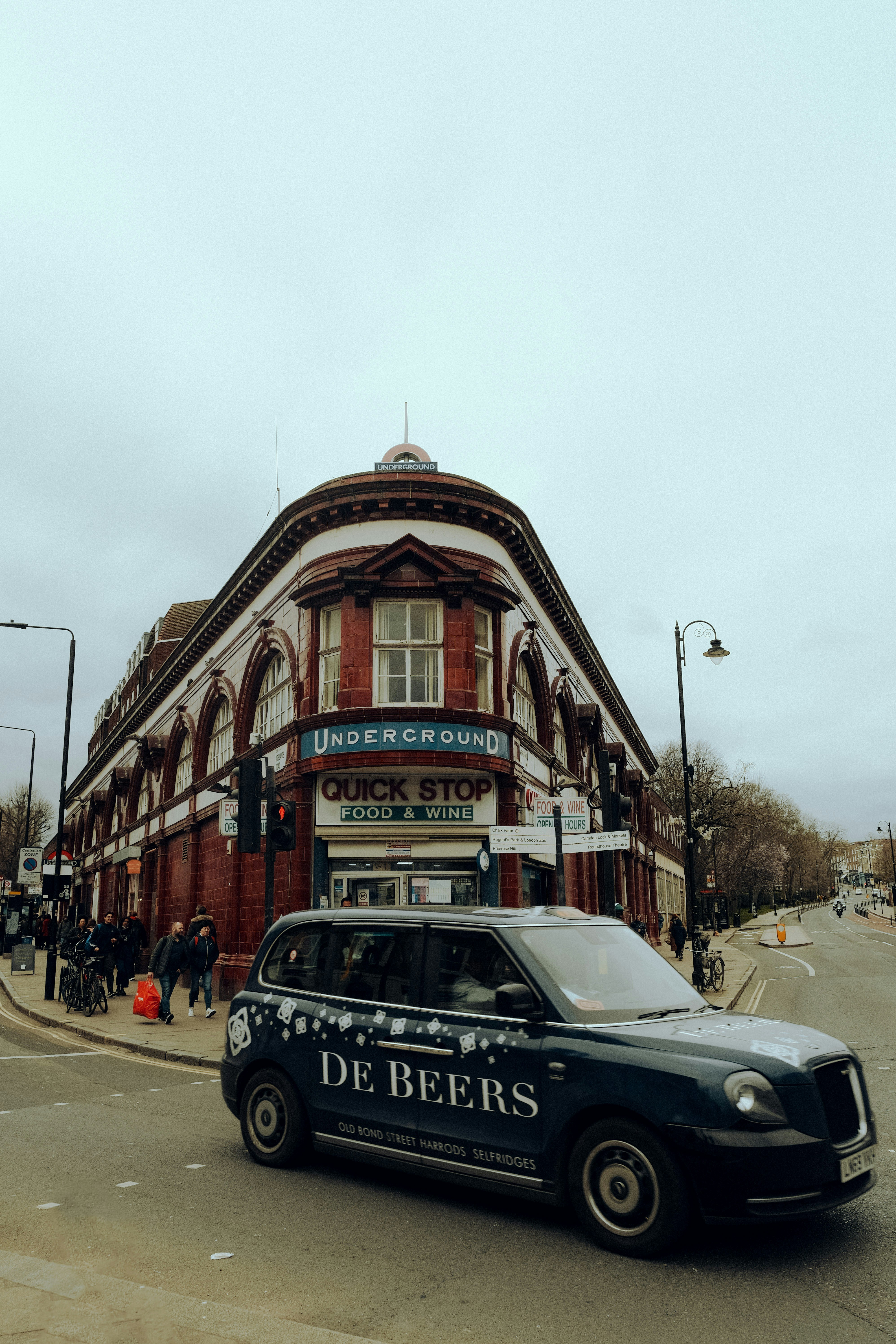 A taxi cab is parked in front of a building photo – Free London Image ...