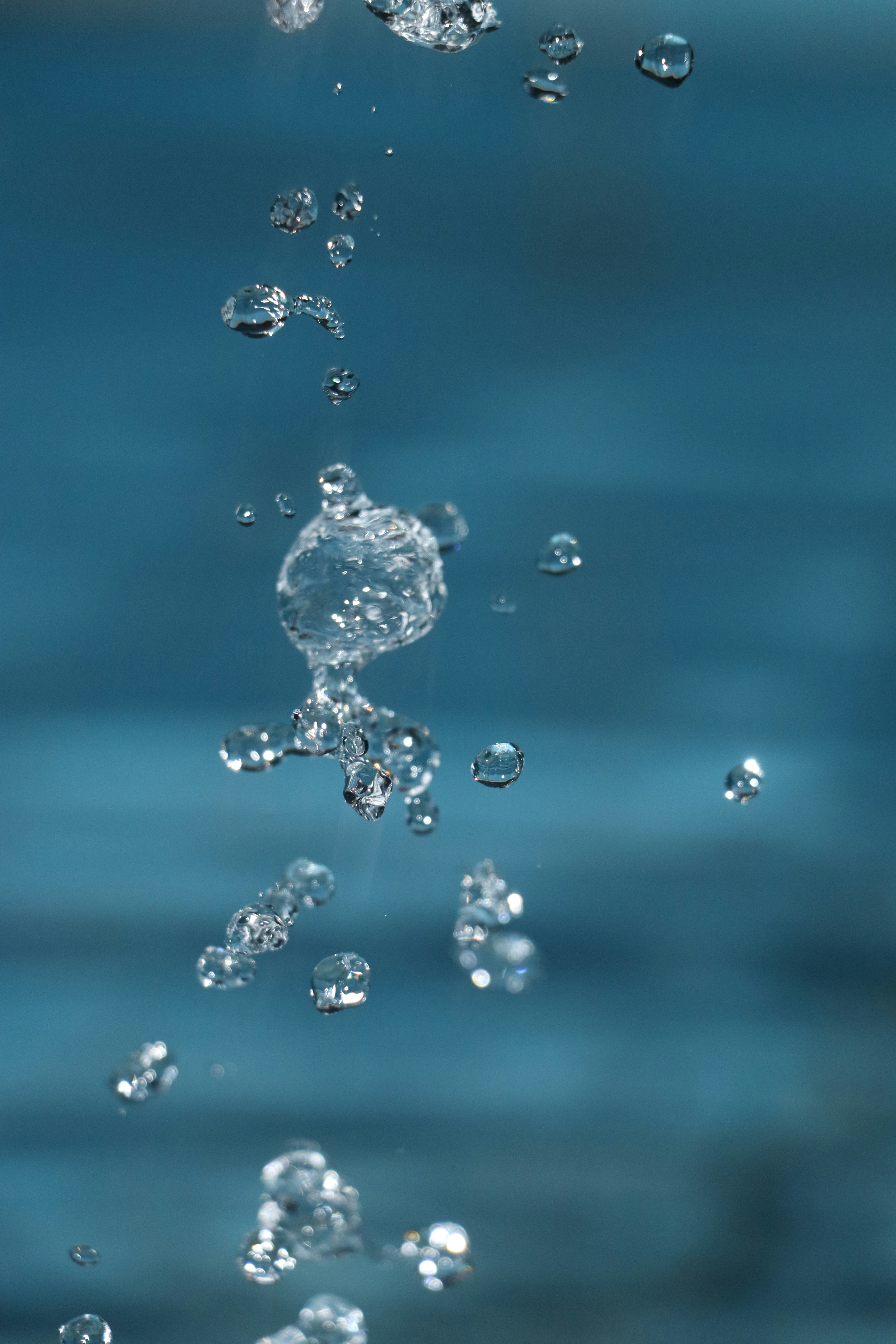 A close up of water bubbles in the air photo – Free Water drop Image on ...