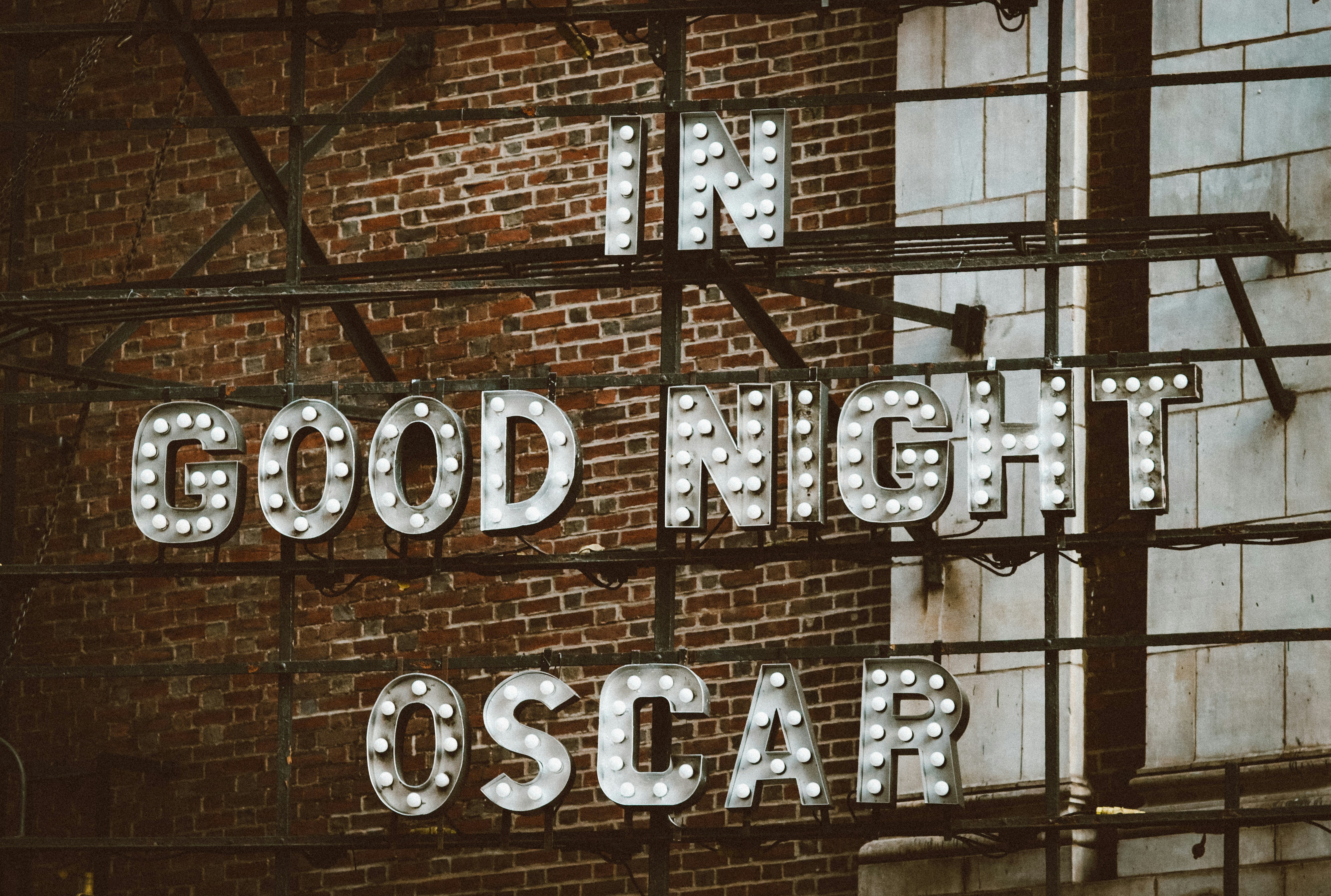 A sign that says in good night oscar on a brick wall photo – Free Brick ...