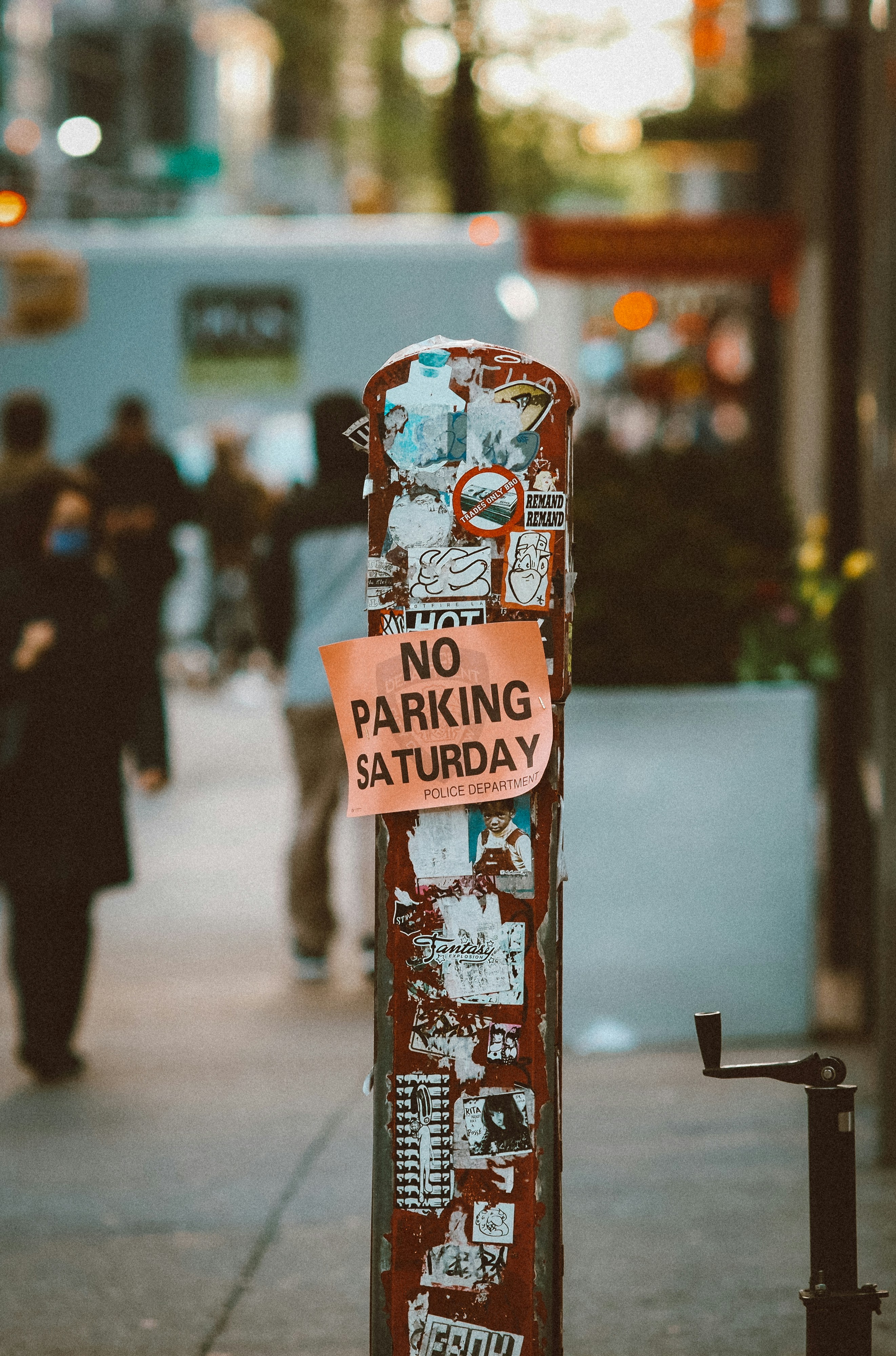 No Parking Saturday: A Stickered Post in the City Pulse
