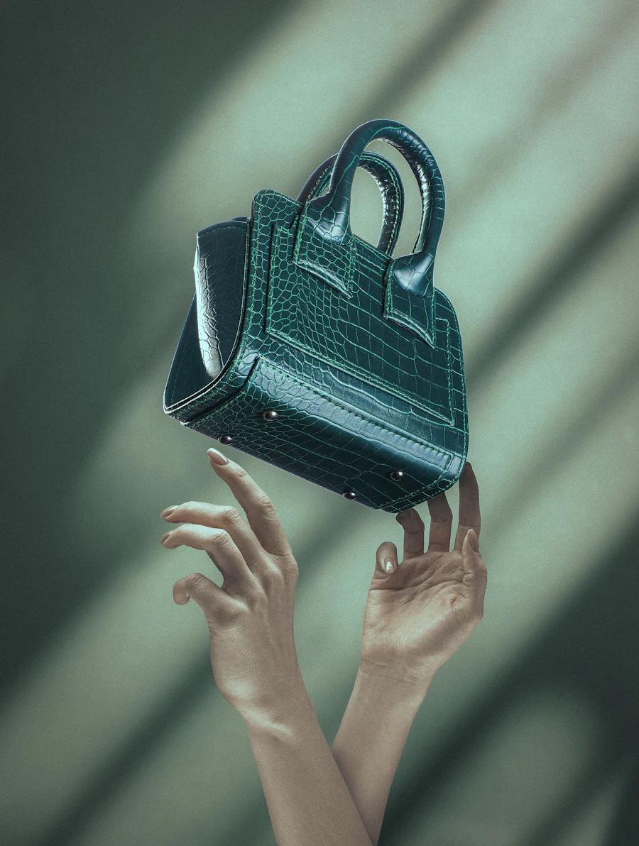 Teal crocodile-textured handbag suspended above two outstretched hands against a soft green backdrop with diagonal light streaks.