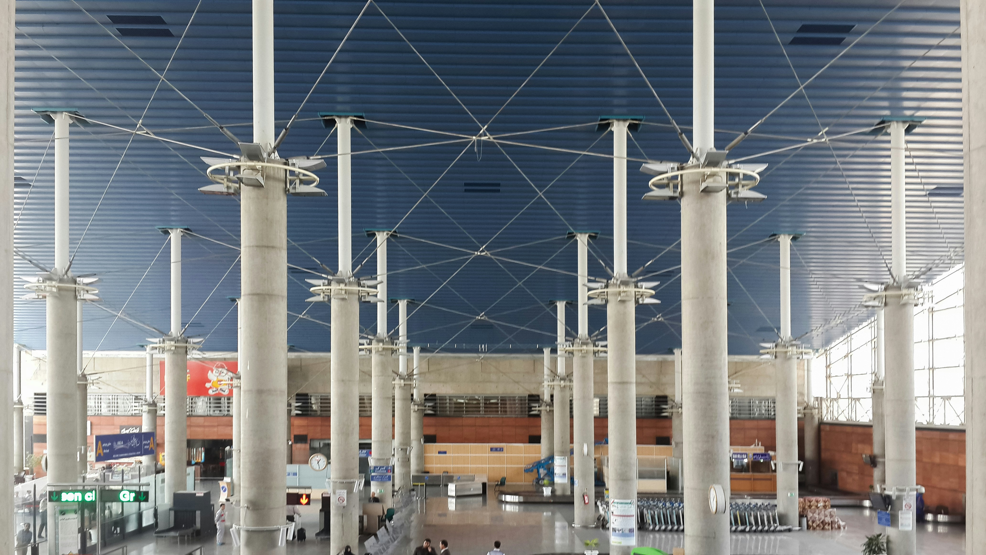 A large building with a bunch of pillars inside of it photo – Free ...