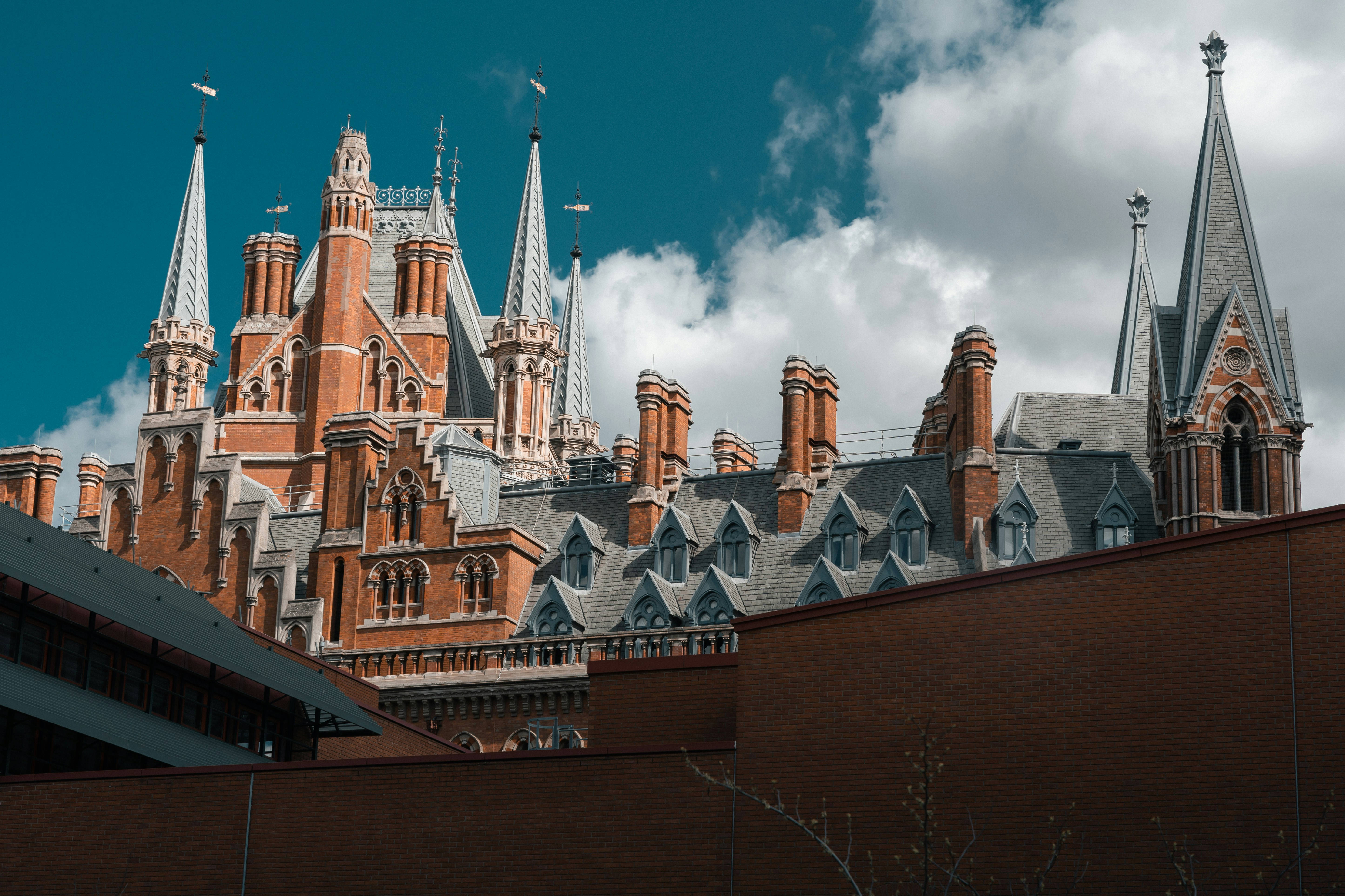 A large building with many spires on top of it photo – Free St. pancras ...