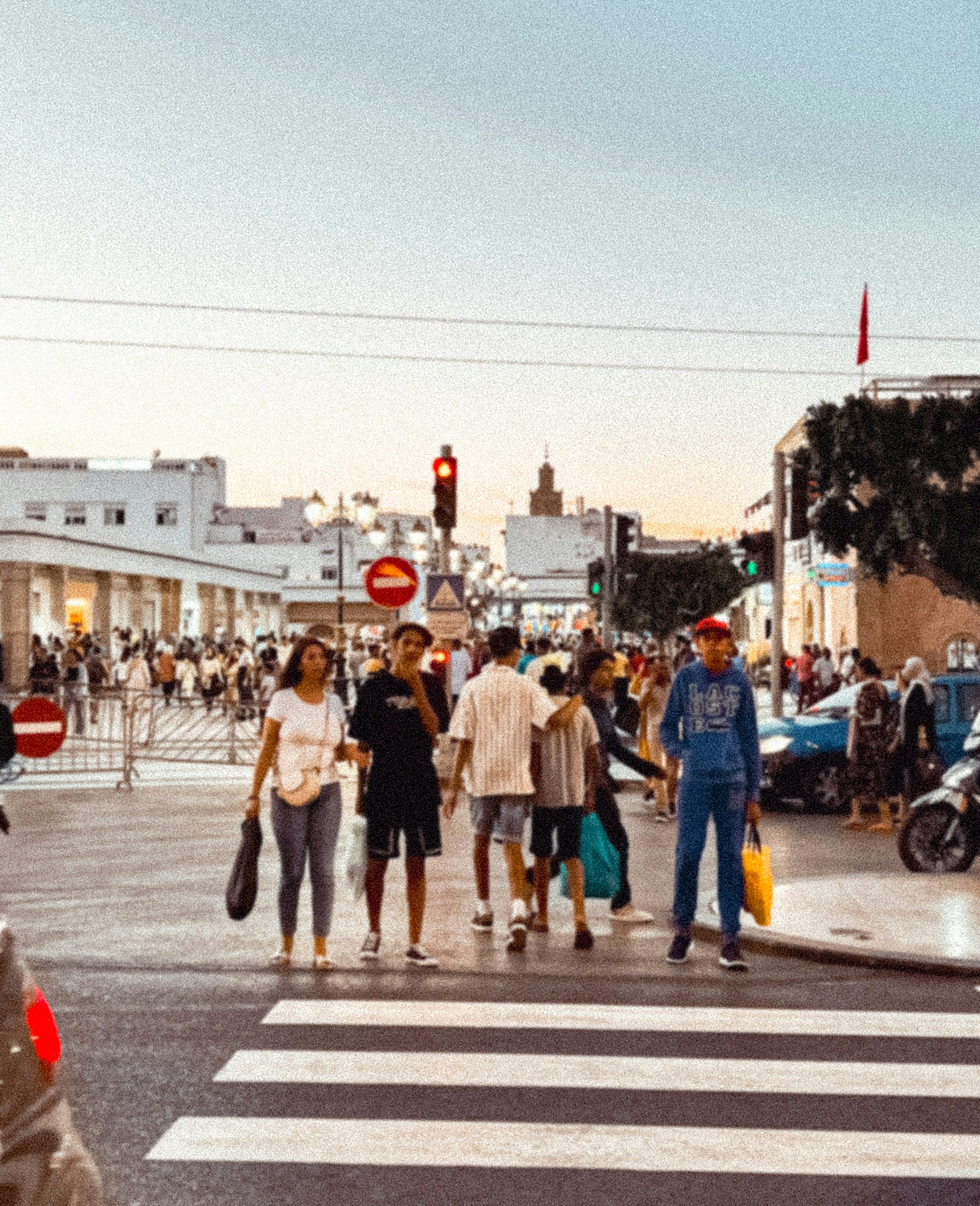 Dusk Crossing: A Quiet Convergence at a Busy City Crosswalk