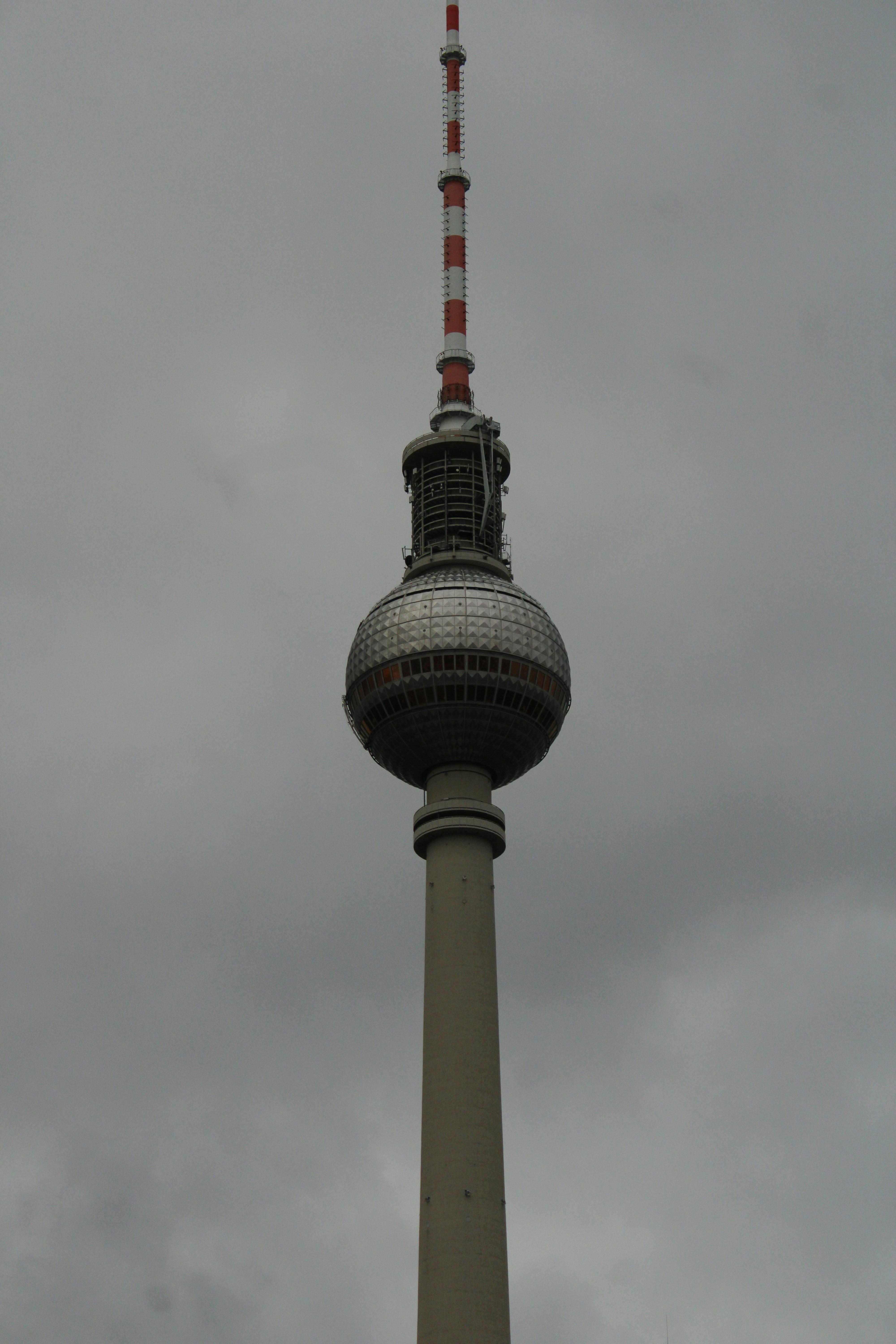 Berlin's Sentinel: Fernsehturm Piercing a Looming Gray Sky