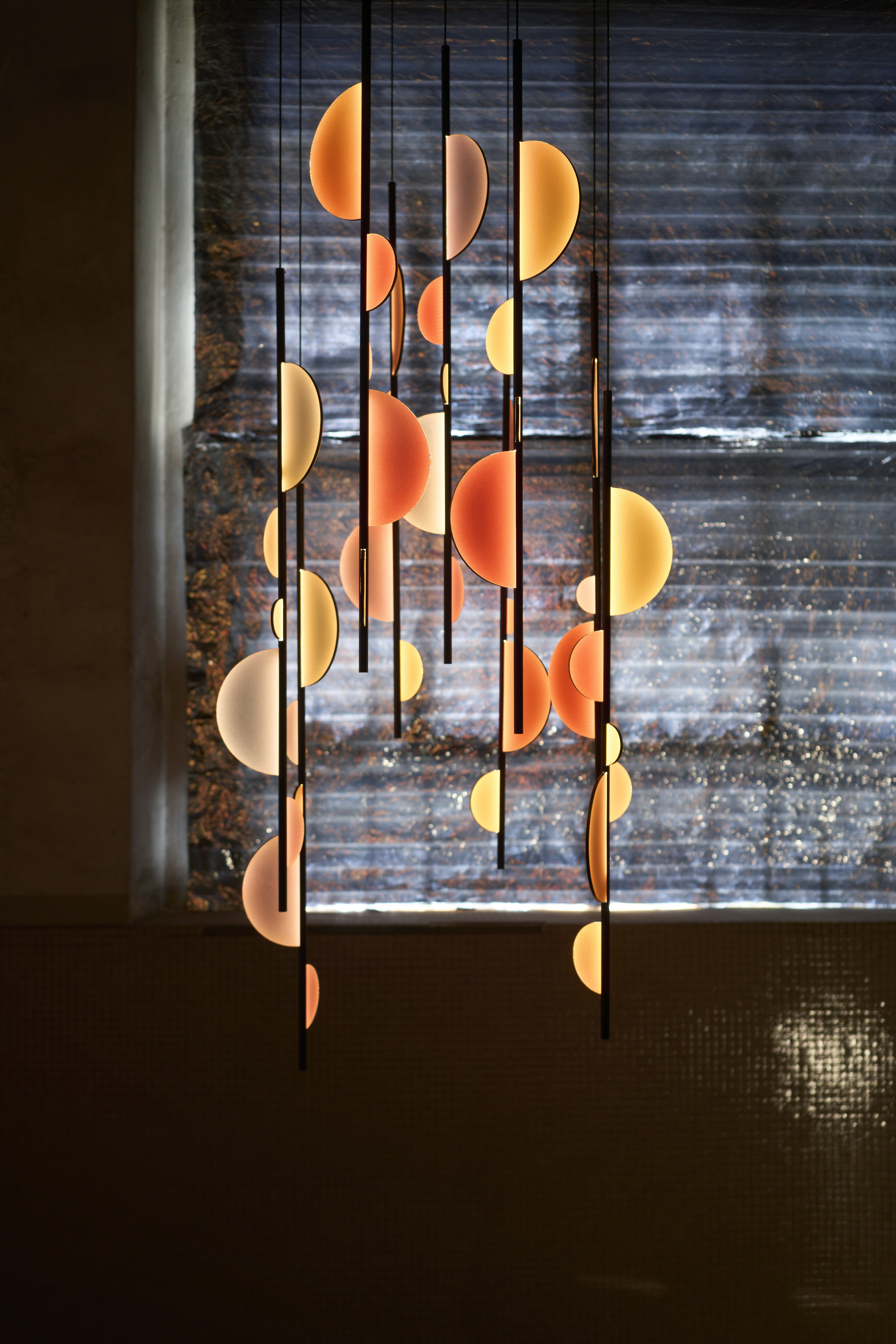Circles in Suspension: Warm Orbs Drifting Before a Weathered Backdrop