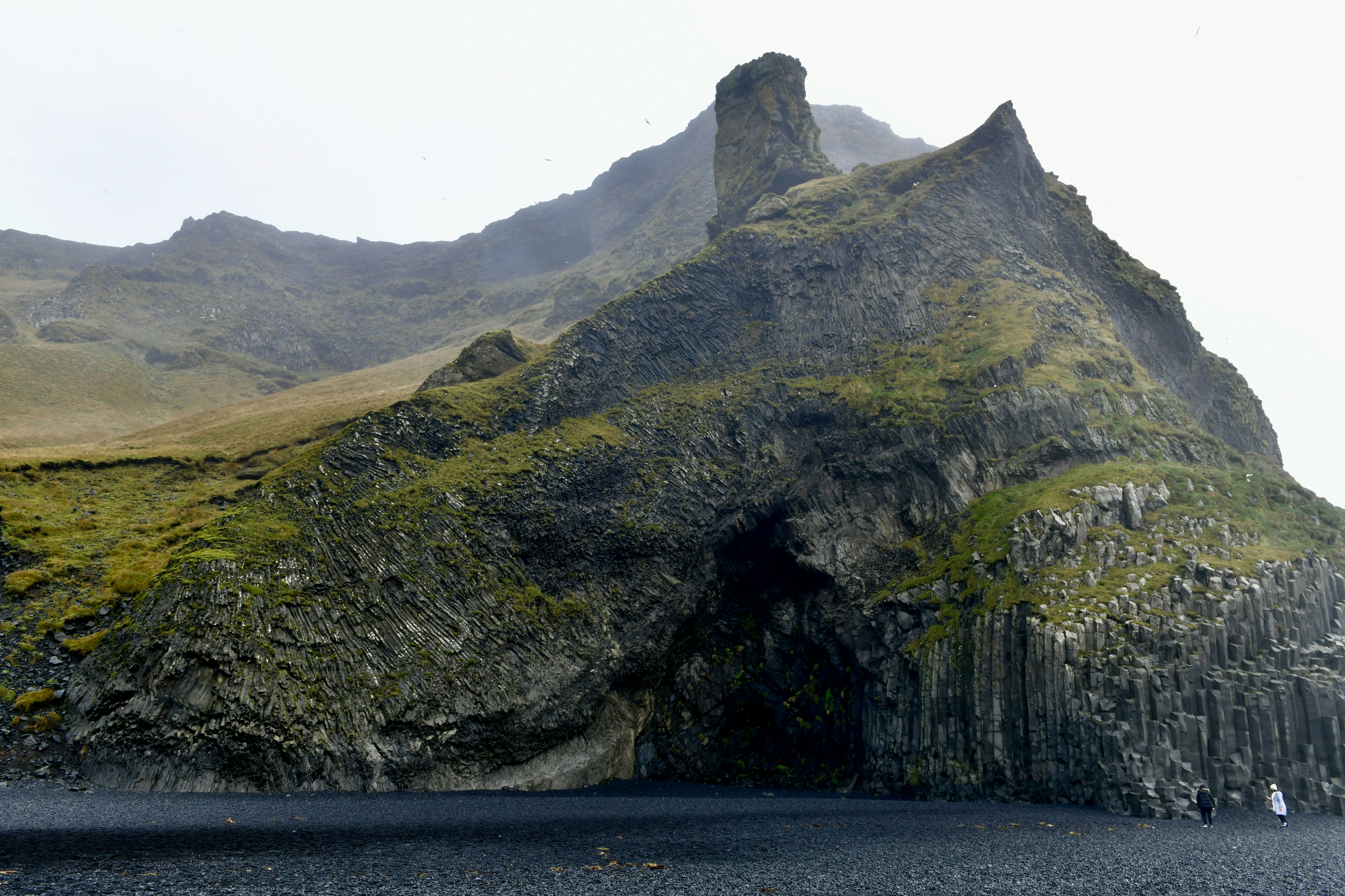 Basalt Sentinels Over a Jet-Black Shore