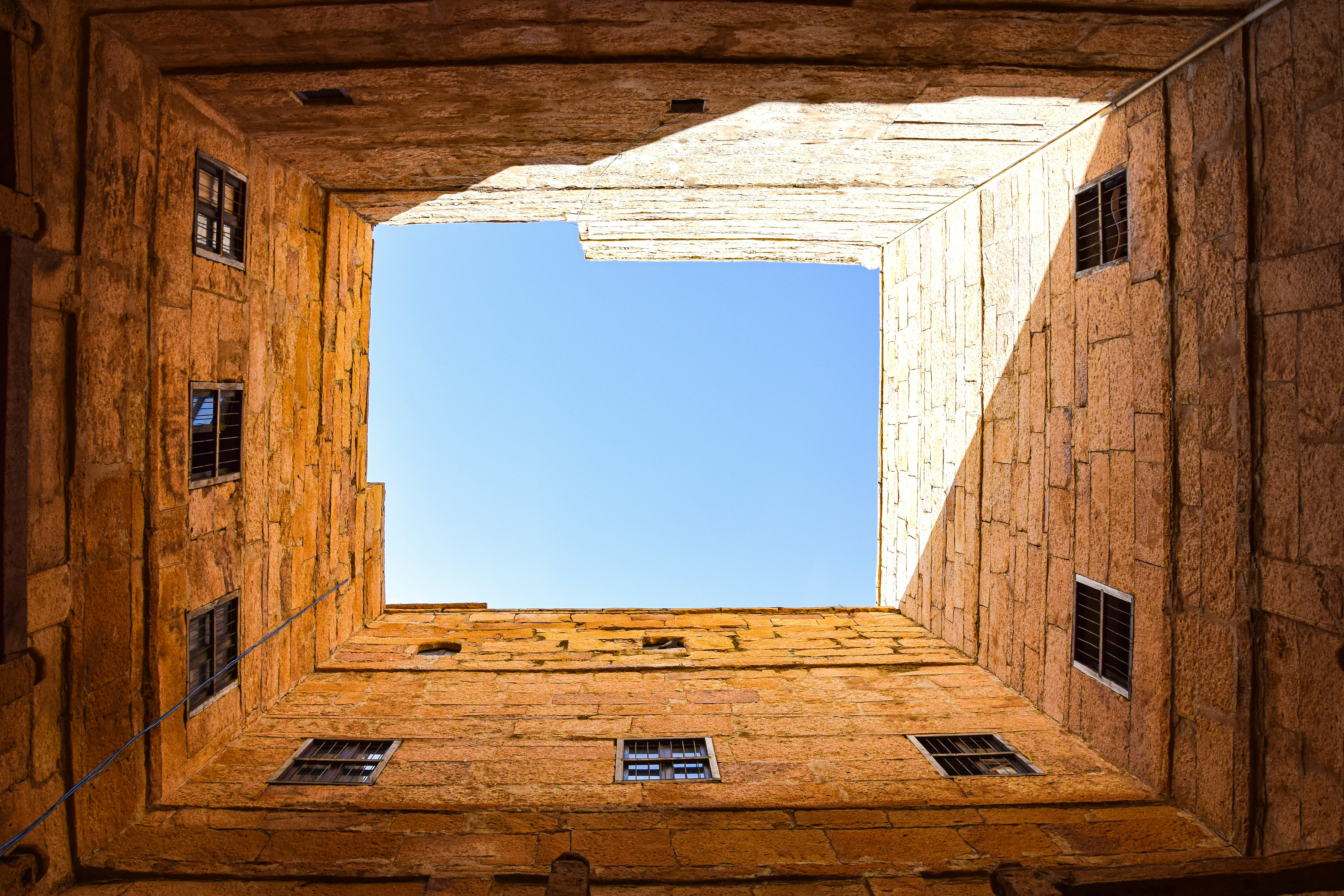 A very tall building with a sky in the background photo – Free ...