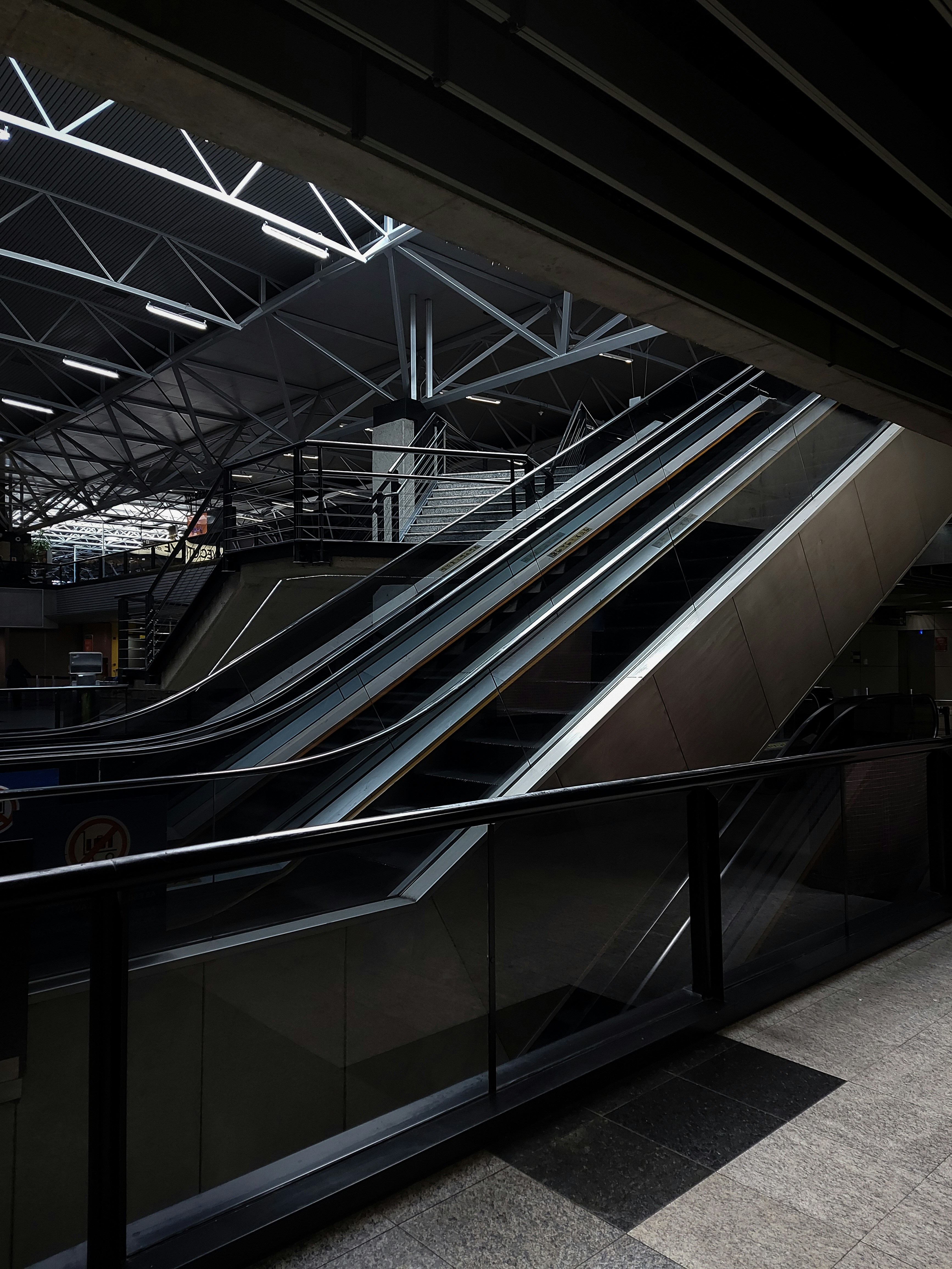 An escalator in a subway station with metal railings photo – Free Urban ...
