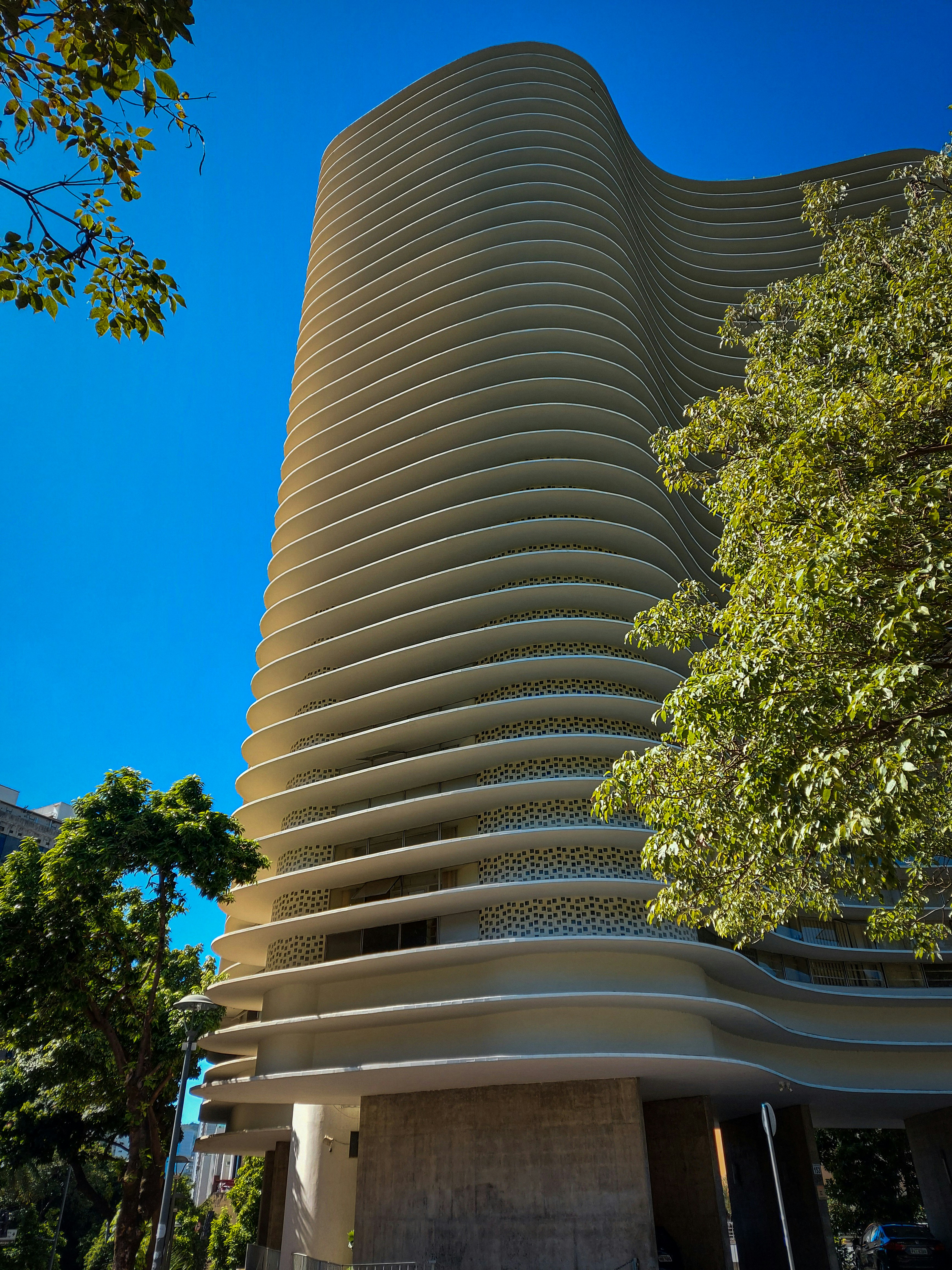 a tall building with a spiral design on the side of it