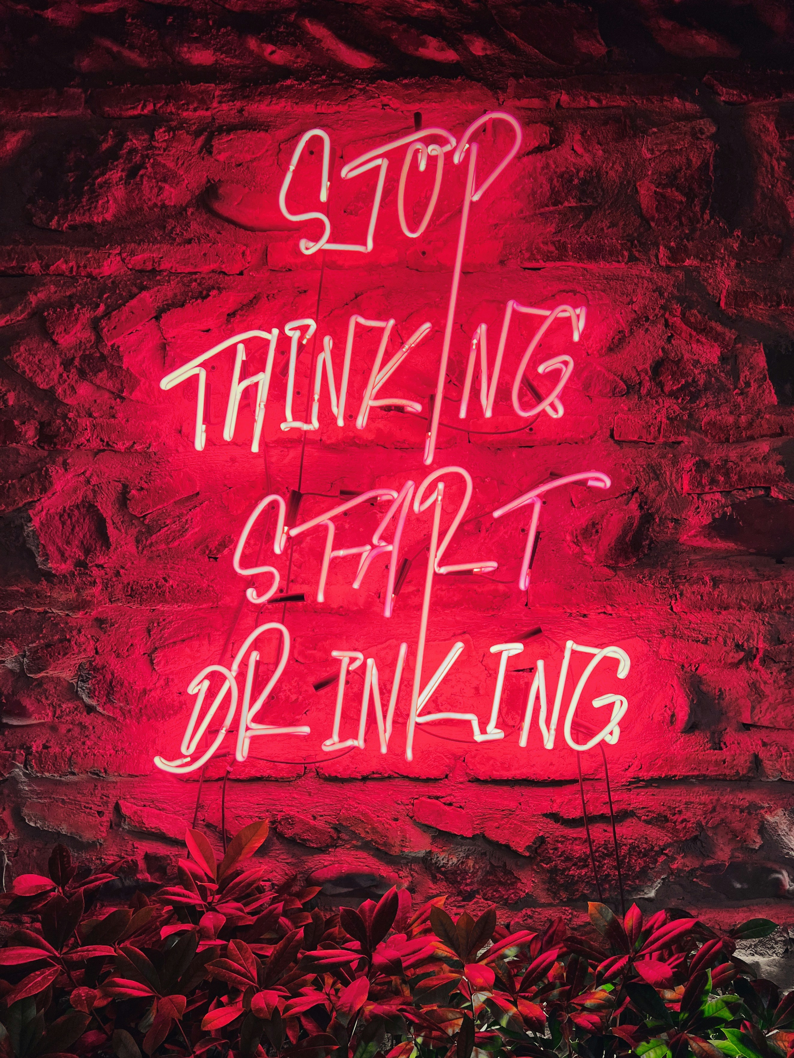 Neon Red Reverie: Stop Thinking Start Drinking