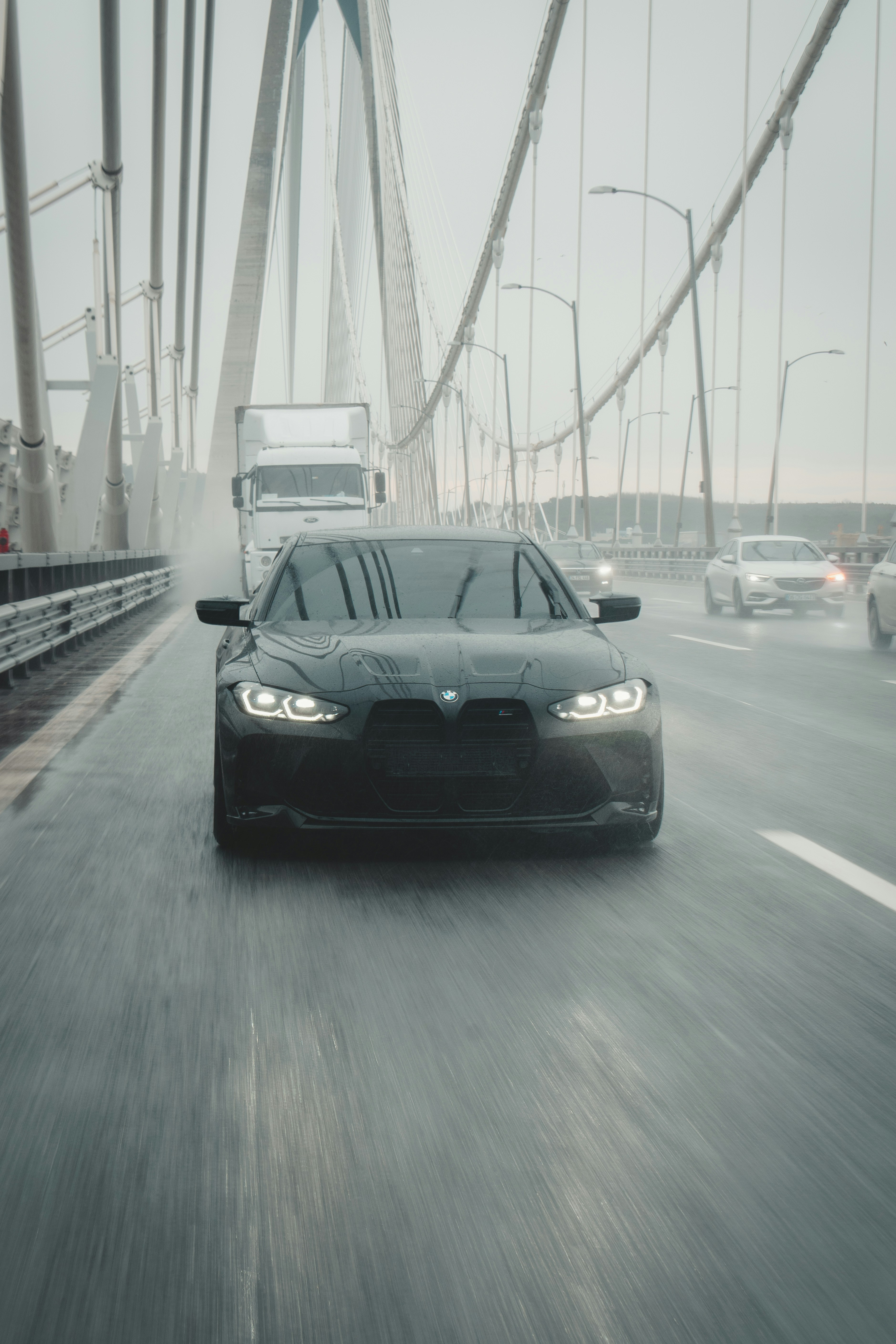 A car driving across a bridge in the rain photo – Free Türkiye Image on ...