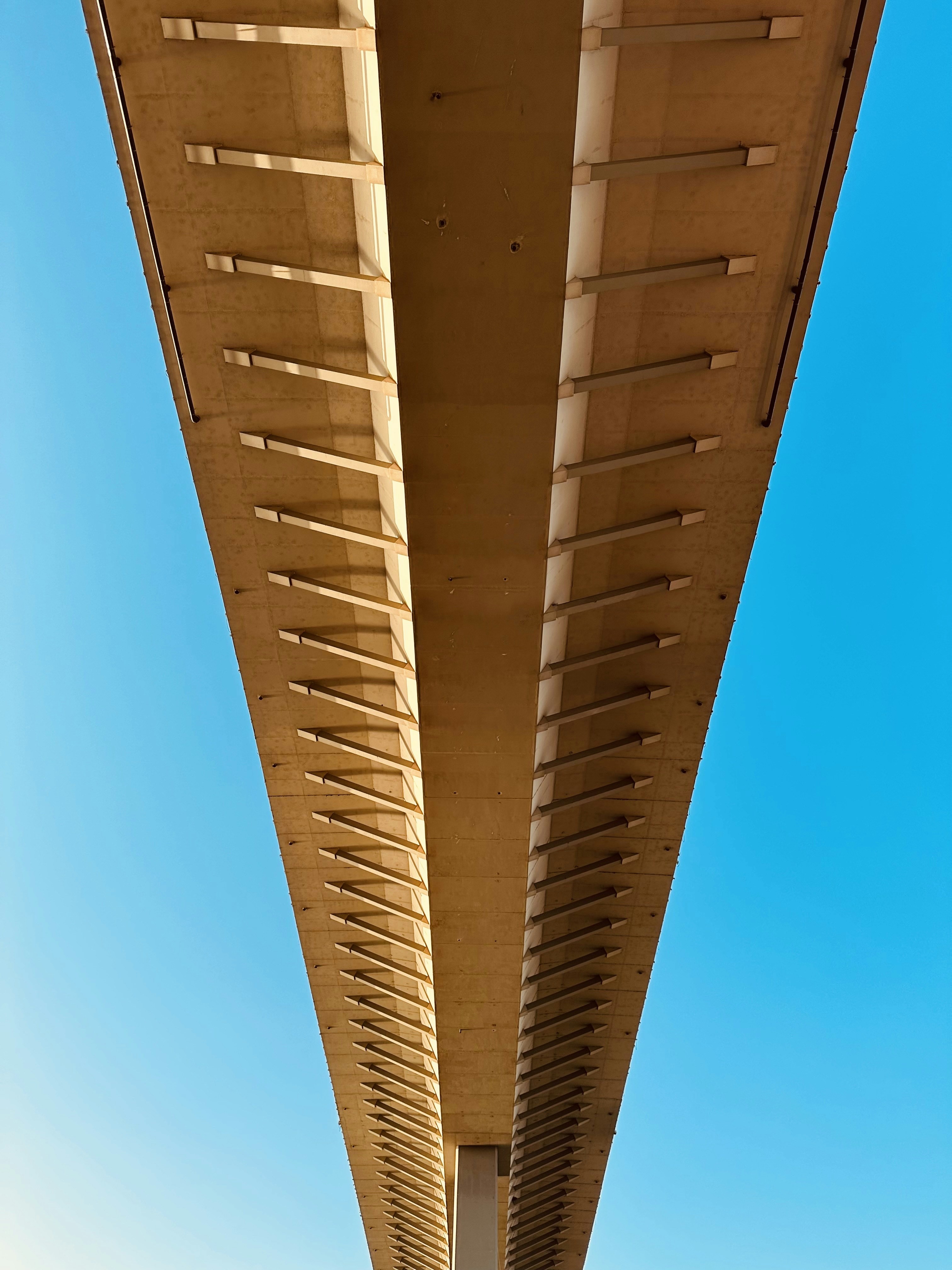 Under the Span: A Symmetrical Dance of Steel and Sky