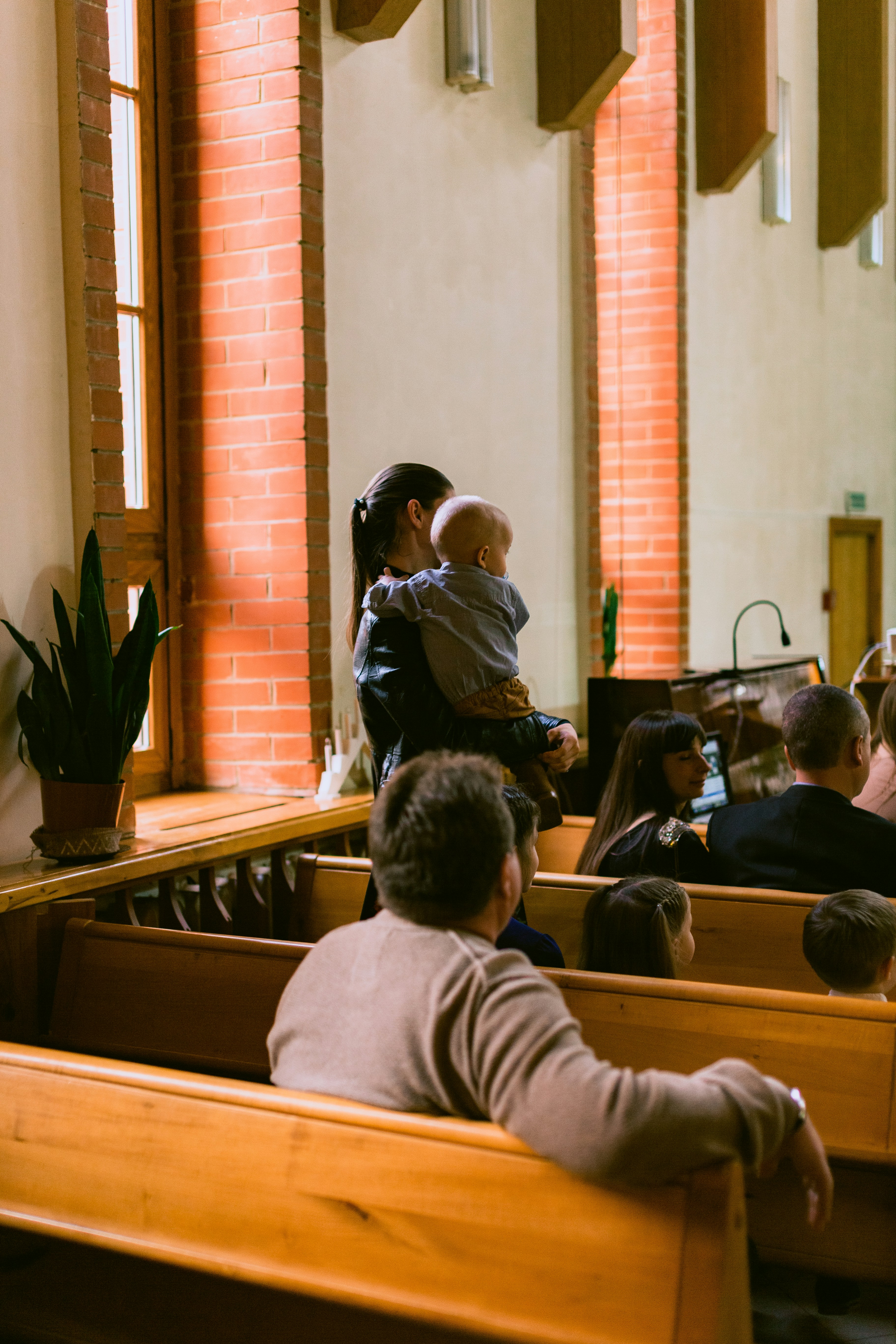 A group of people sitting in pews in a church photo – Free People Image ...