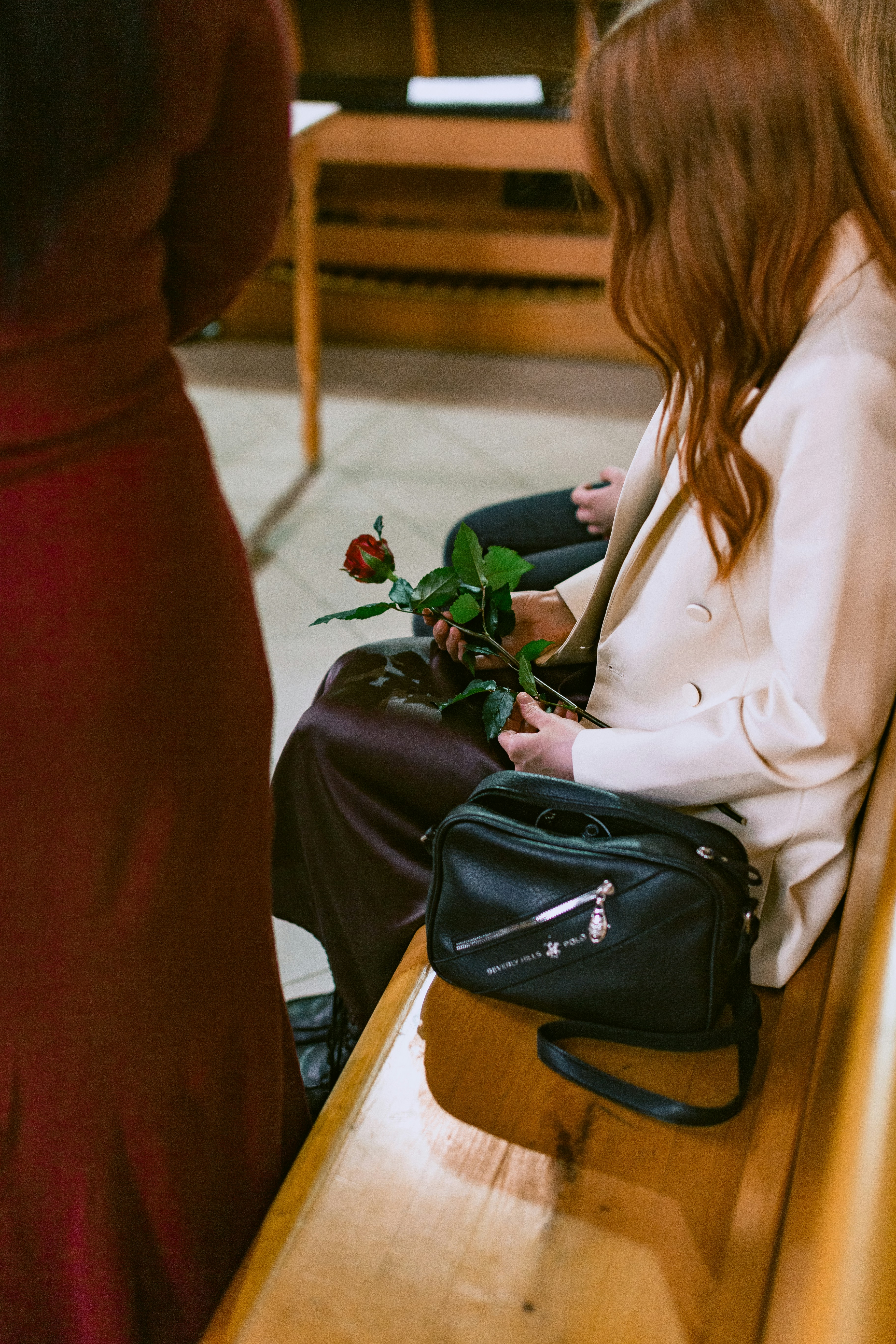 Rose Cradled on a Church Bench: A Quiet Moment in Warm Tones