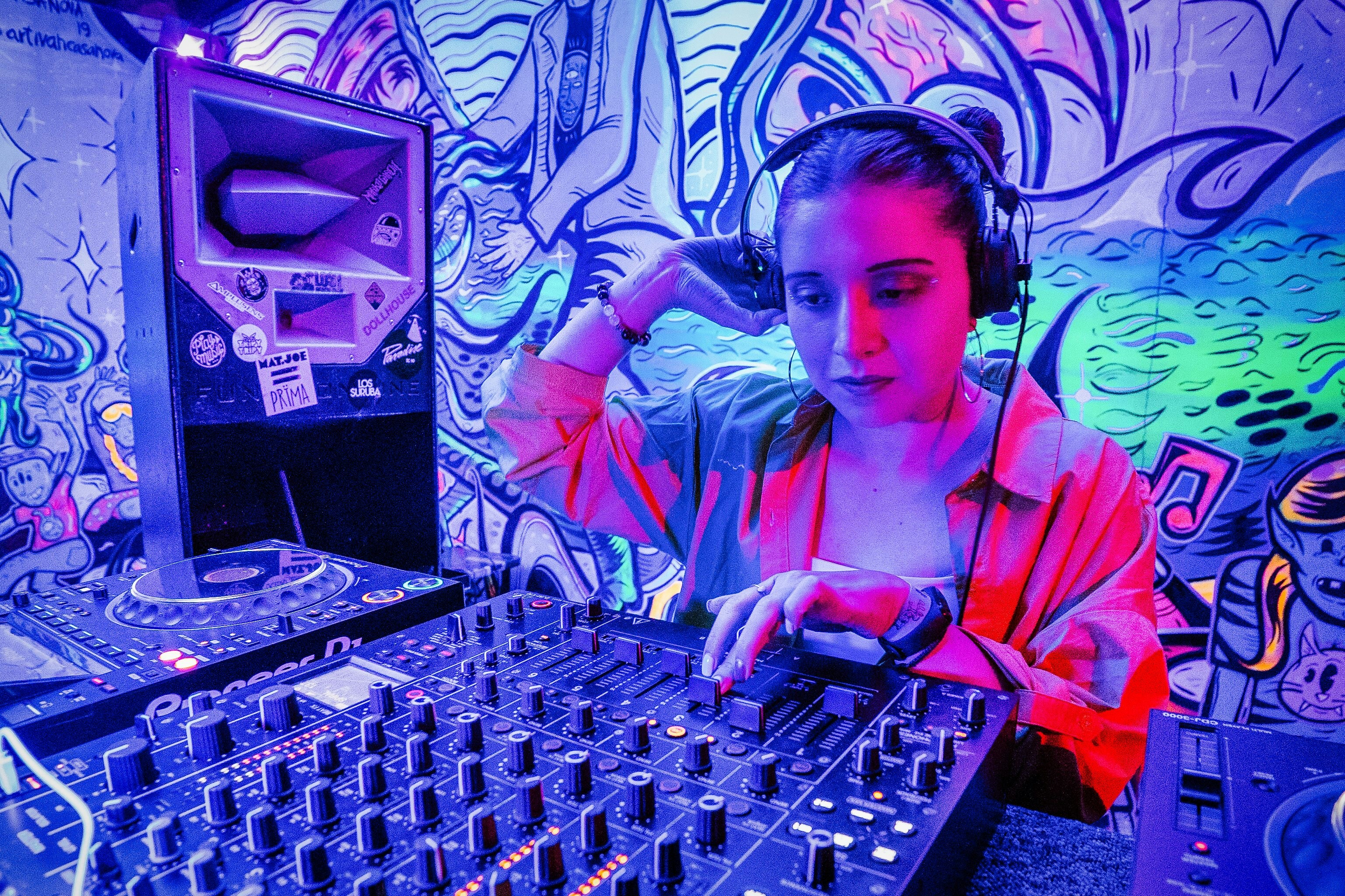 Neon Graffiti DJ Set in a Color-Washed Booth