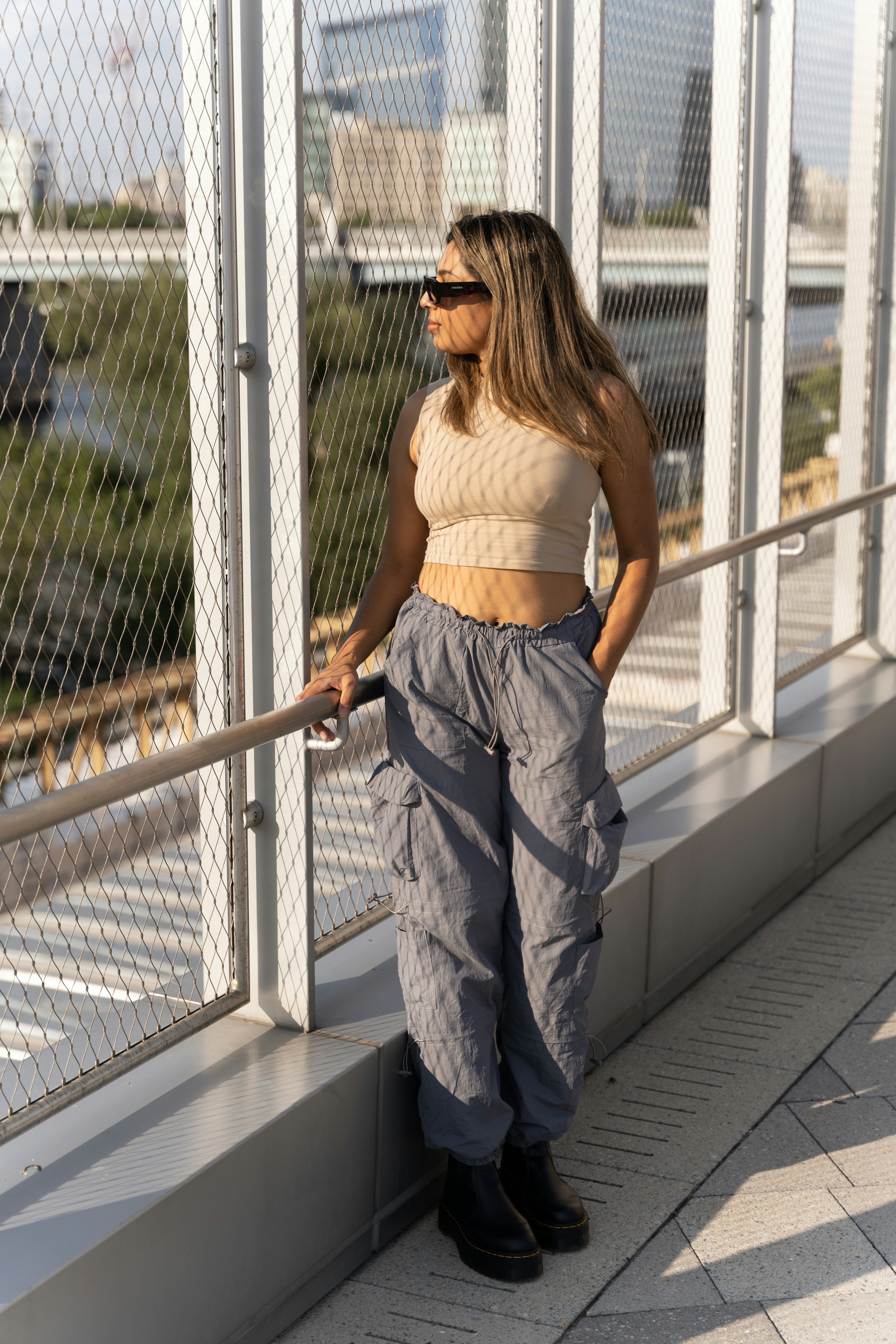 Rooftop Reverie: Sunlit Quiet by a Mesh Balcony