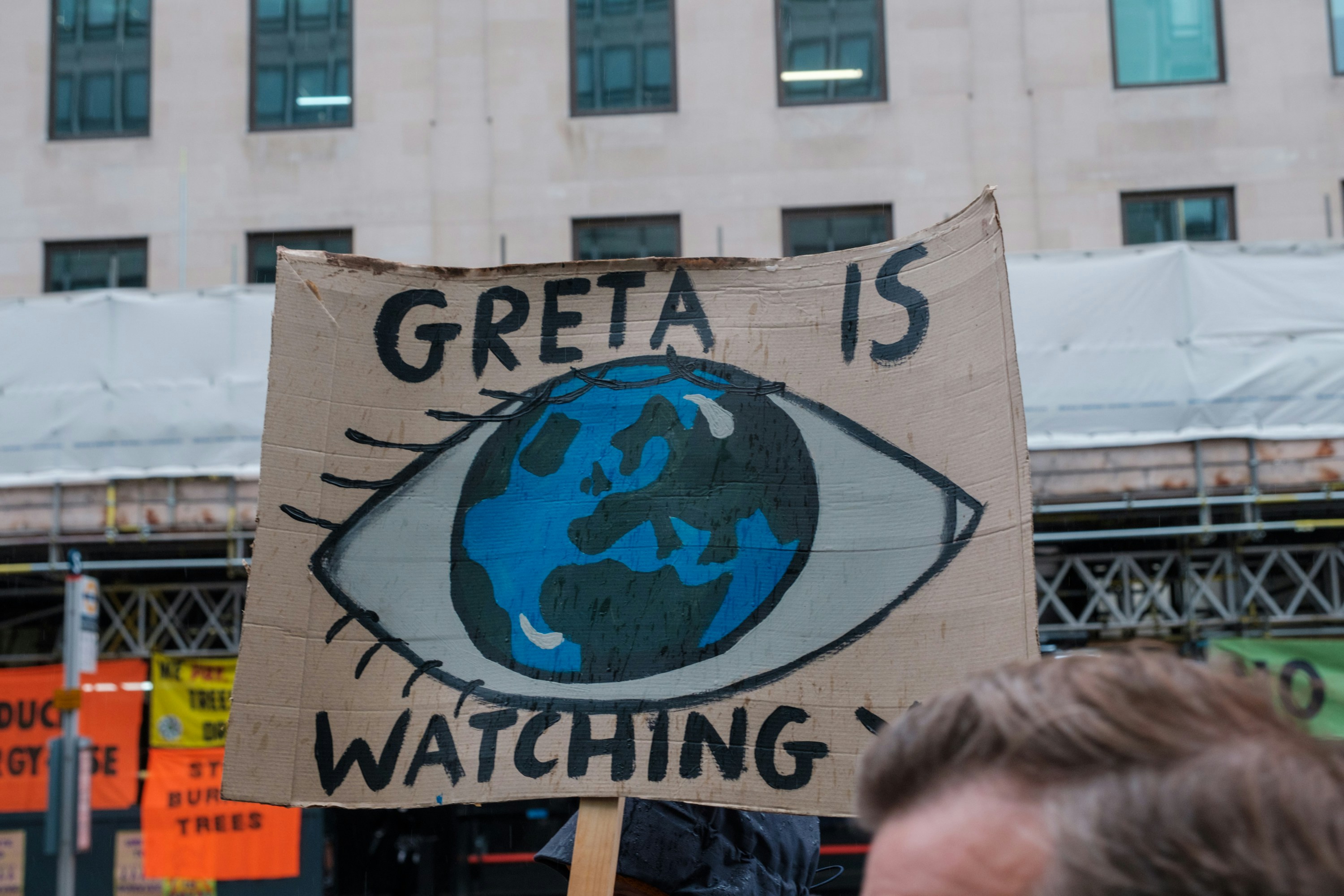 A protest sign with an eye on it photo – Free Current events Image on ...