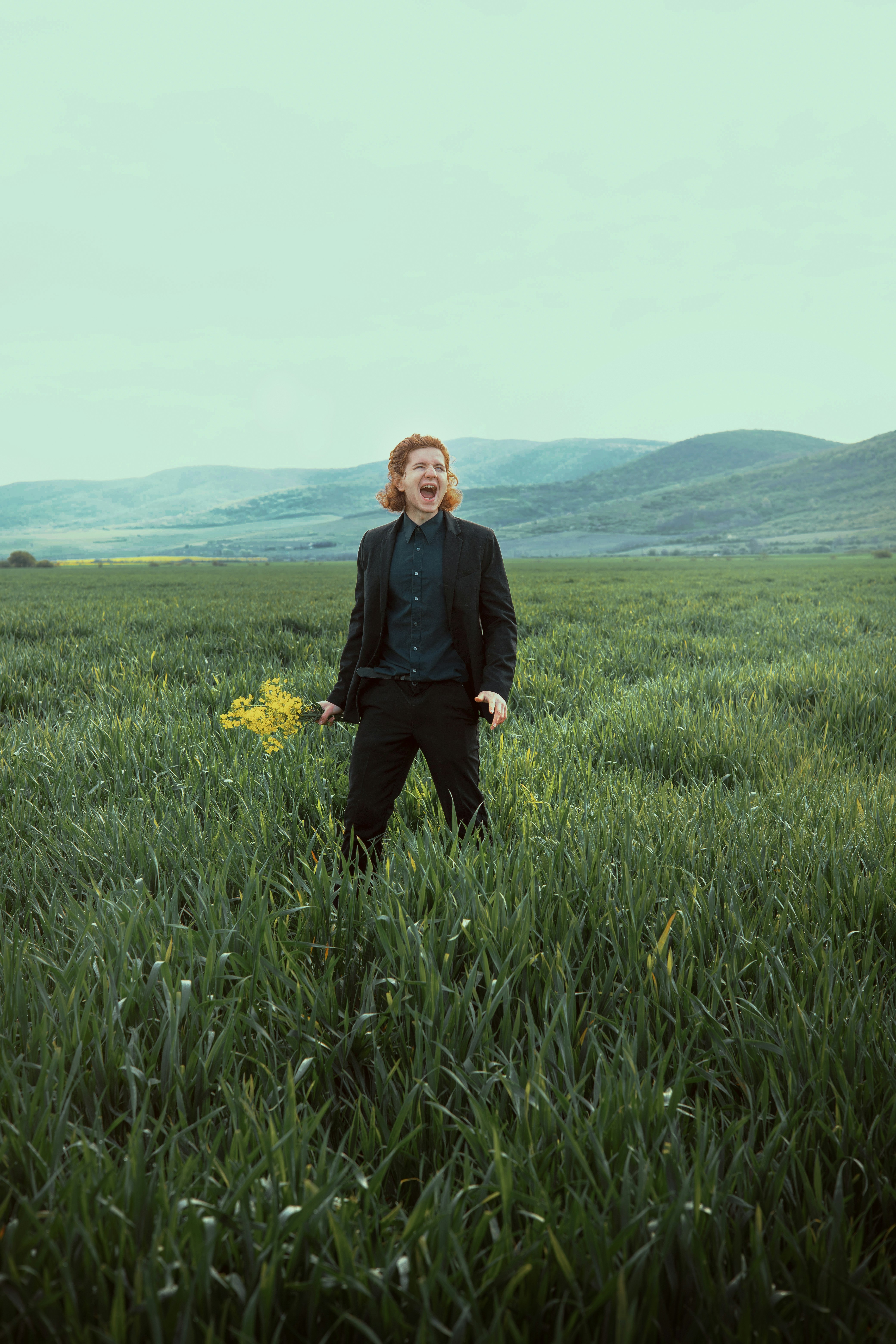A woman standing in a field of tall grass photo – Free Arad Image on ...