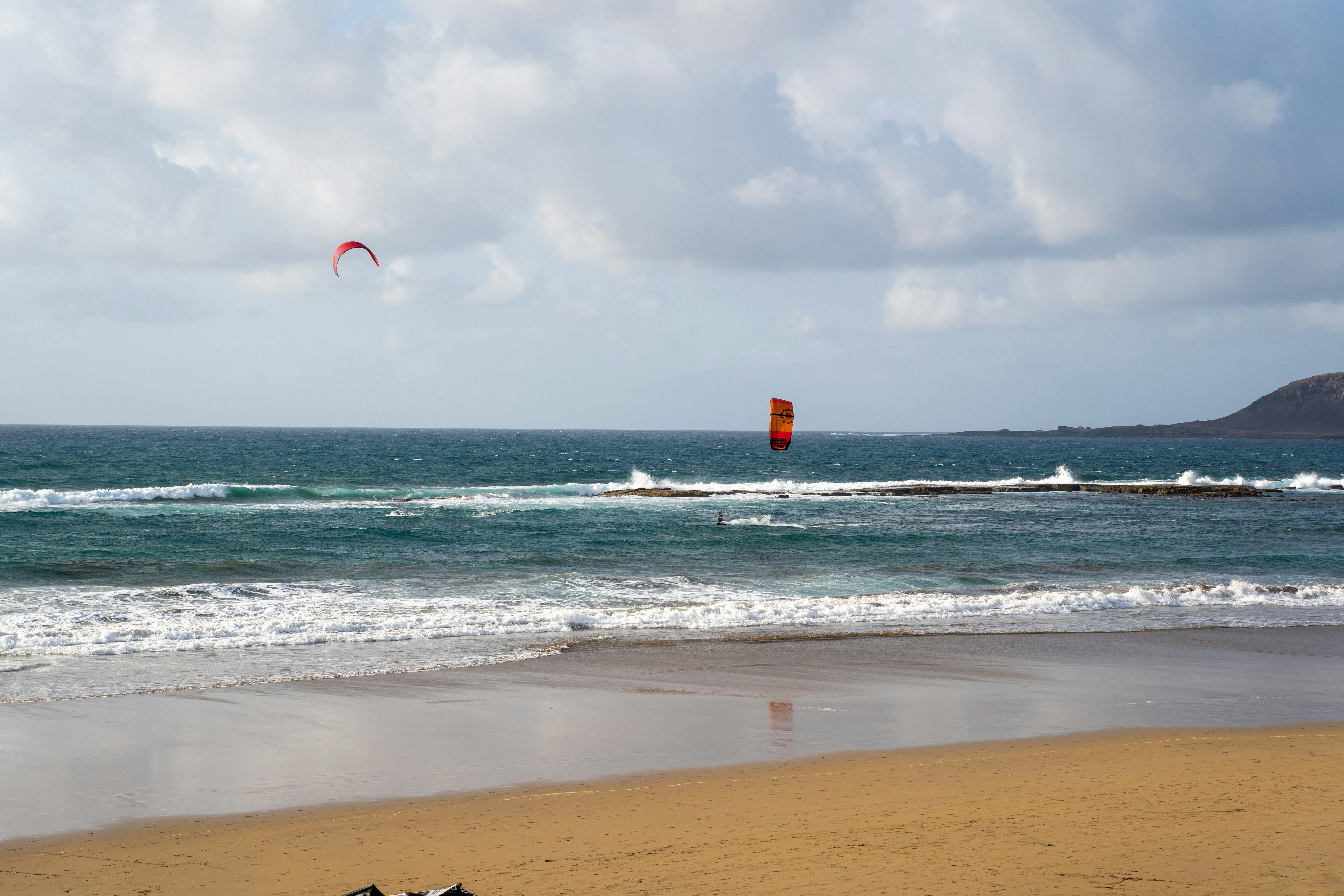 A couple of kites flying over the ocean photo – Free Las palmas de gran ...
