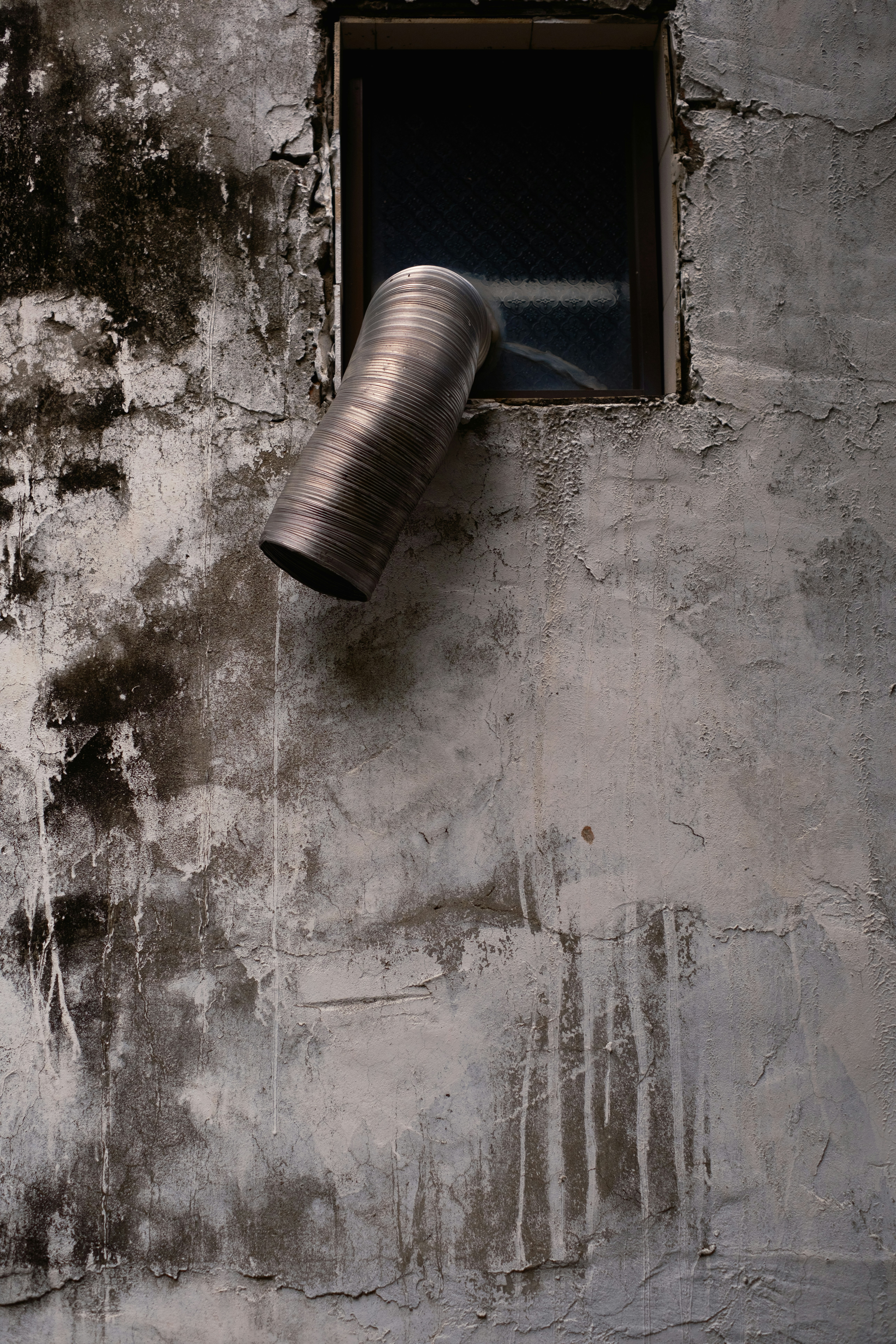 A pipe sticking out of the side of a building photo – Free Fujifilm ...