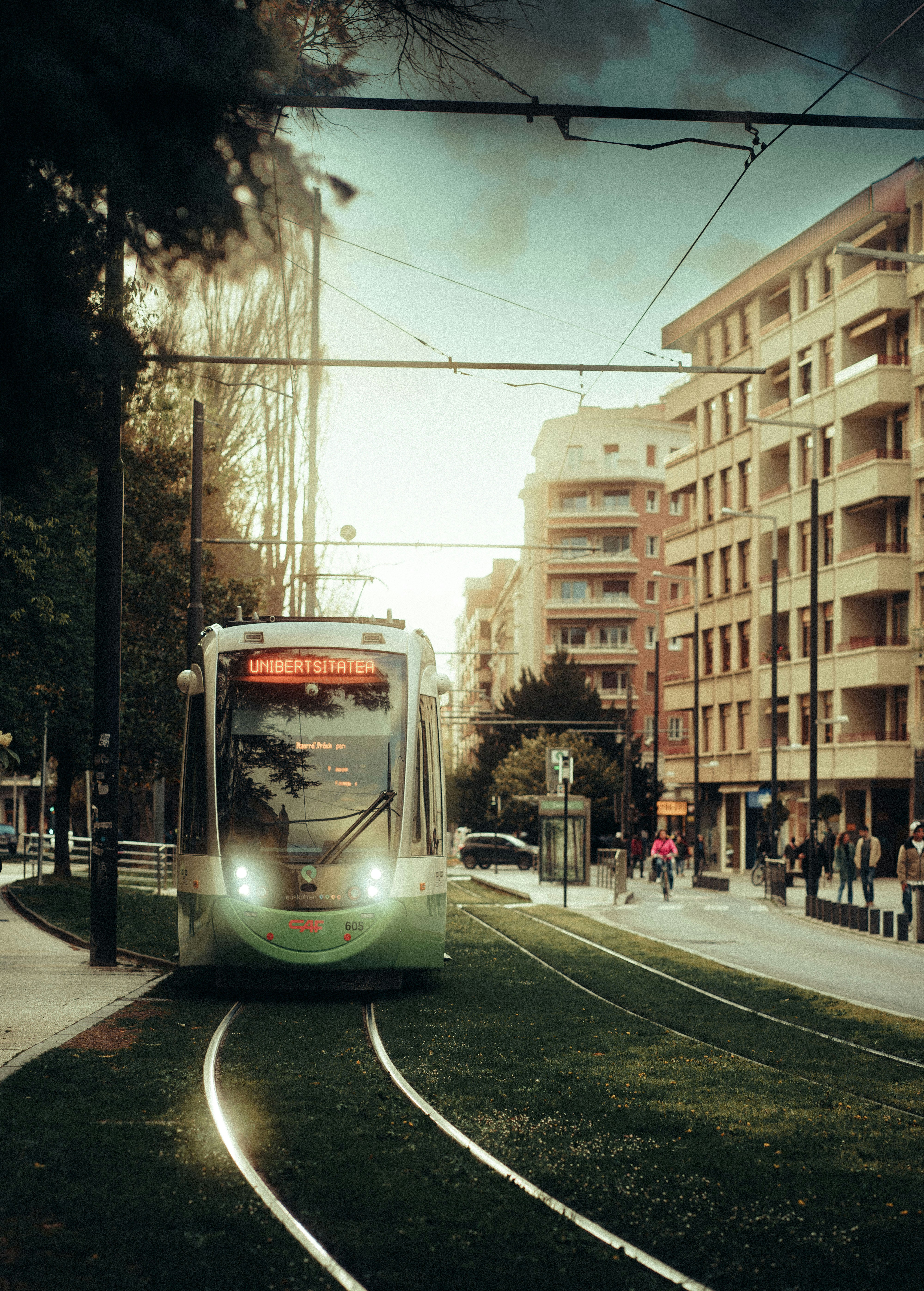 Front-Row Dawn: A Tram Traverses the Curved City Rails