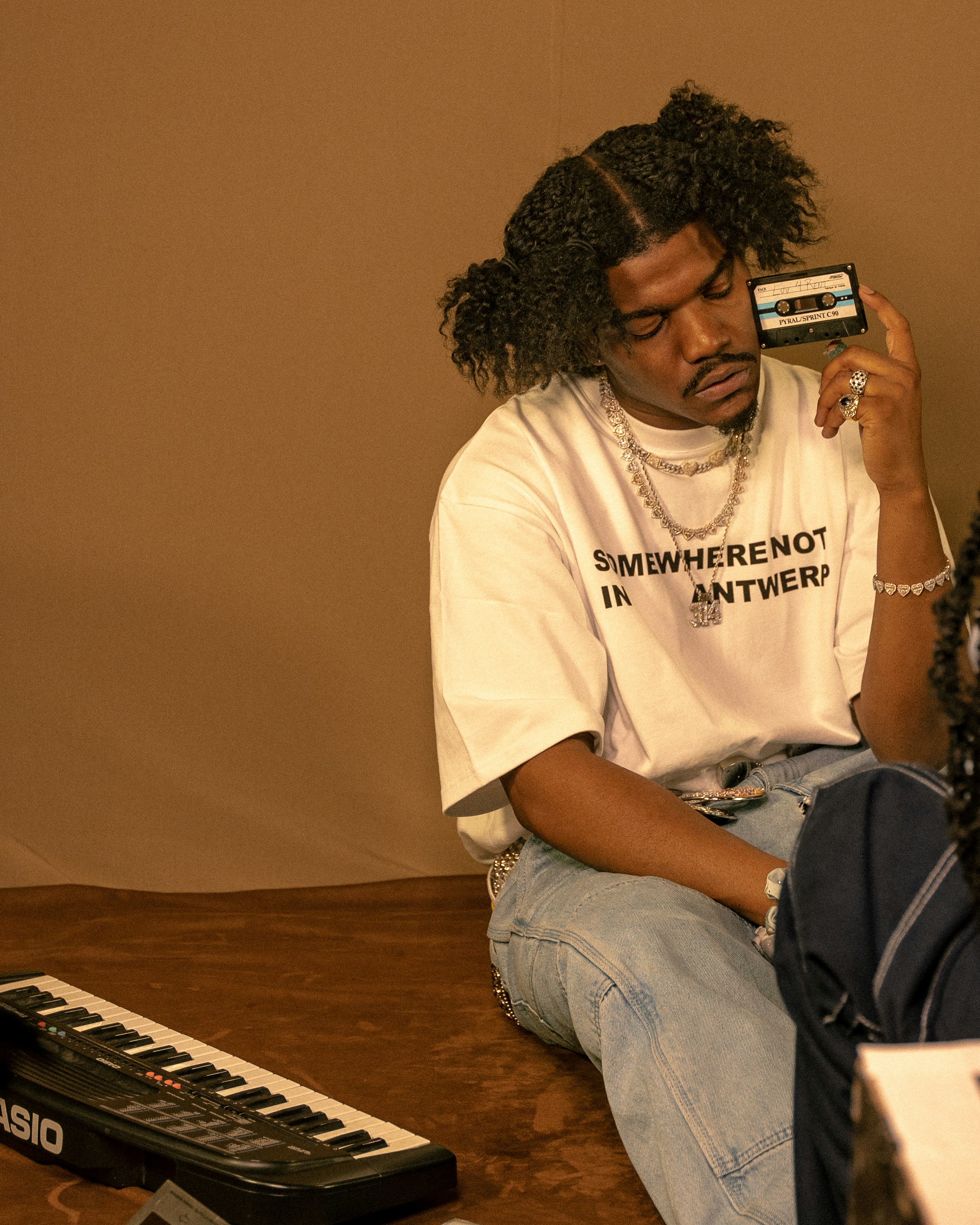 Cassette Confessions: Studio Portrait with a Handheld Tape and Casio Keyboard