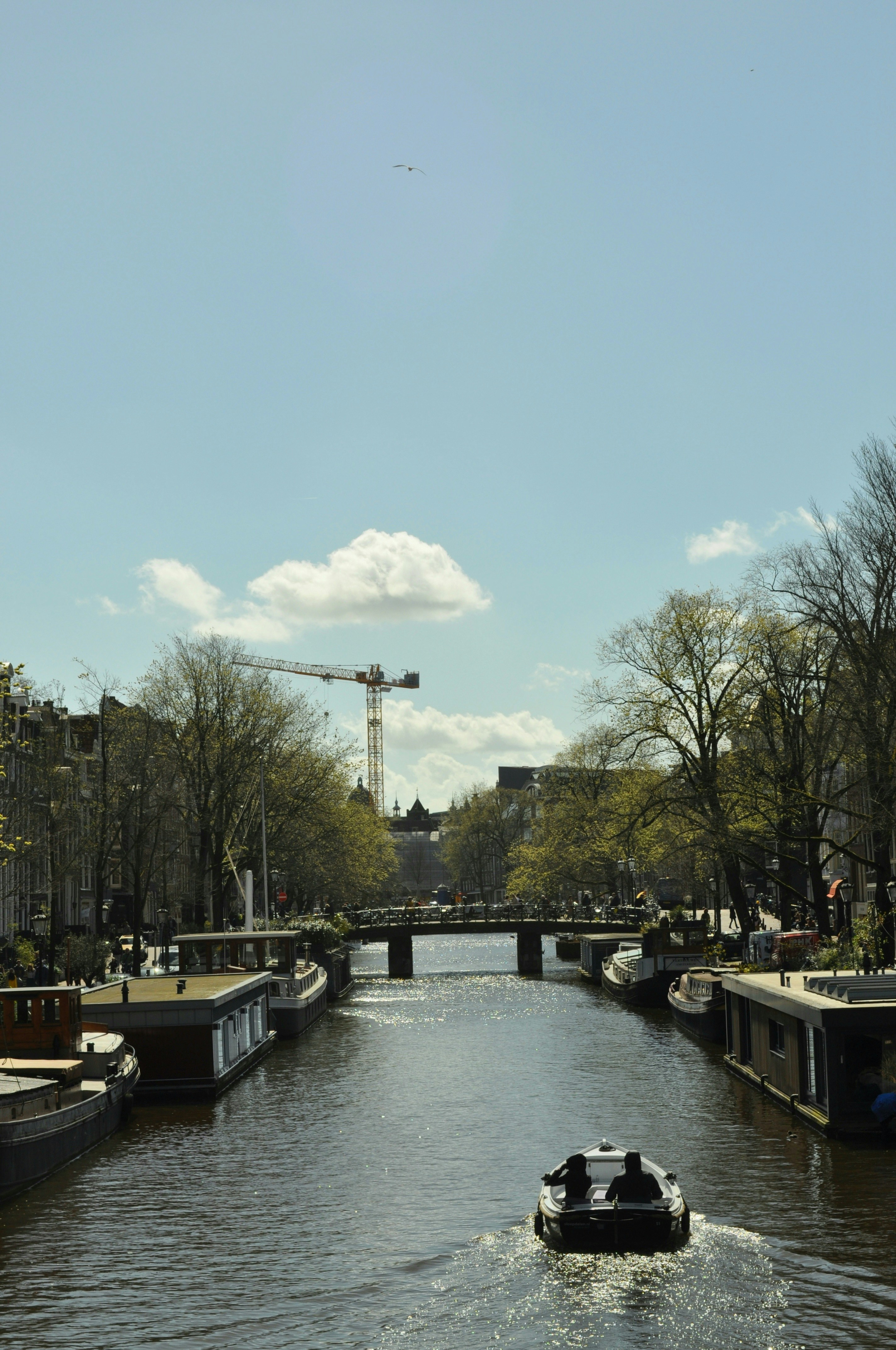 Towboat Glide Through a Sunlit City Canal