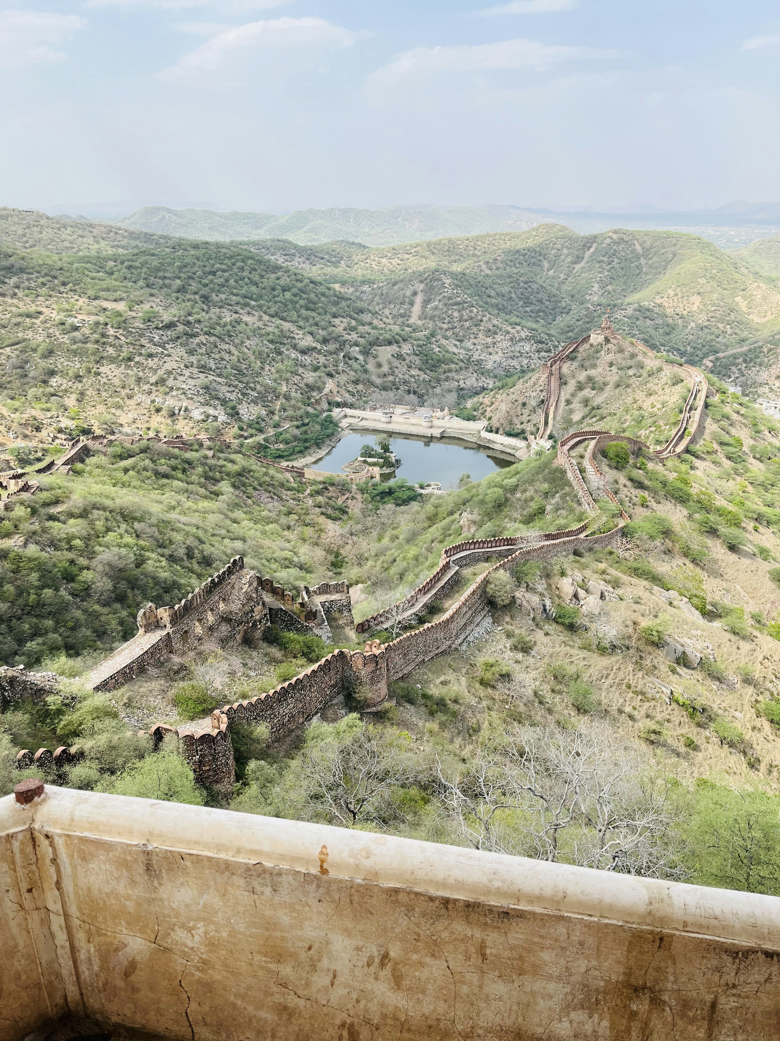 The Serpentine Sentinel: Great Wall Wends Through Green Hills and a Quiet Reservoir