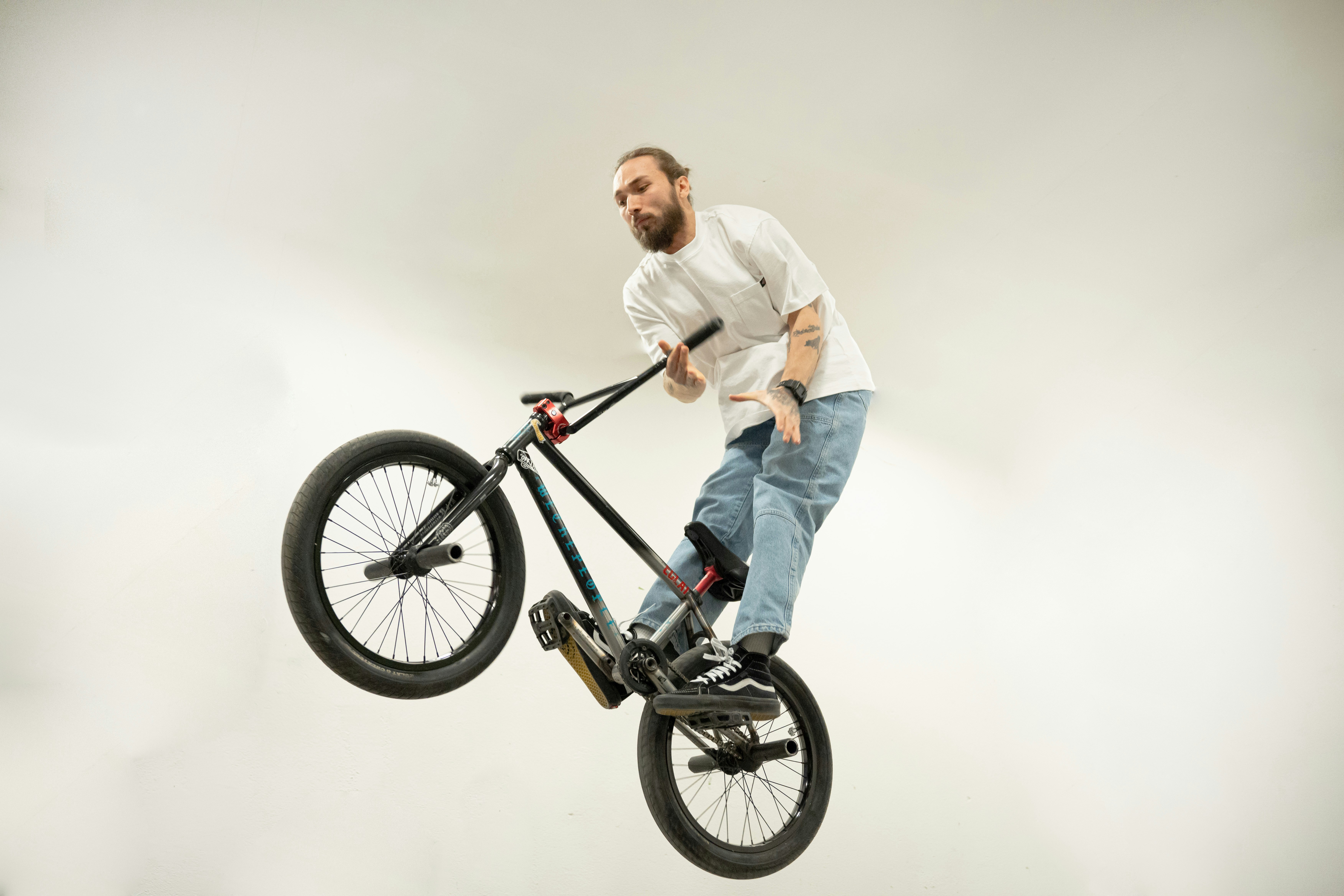 A man on a bike doing a trick in the air photo – Free Türkiye Image on ...