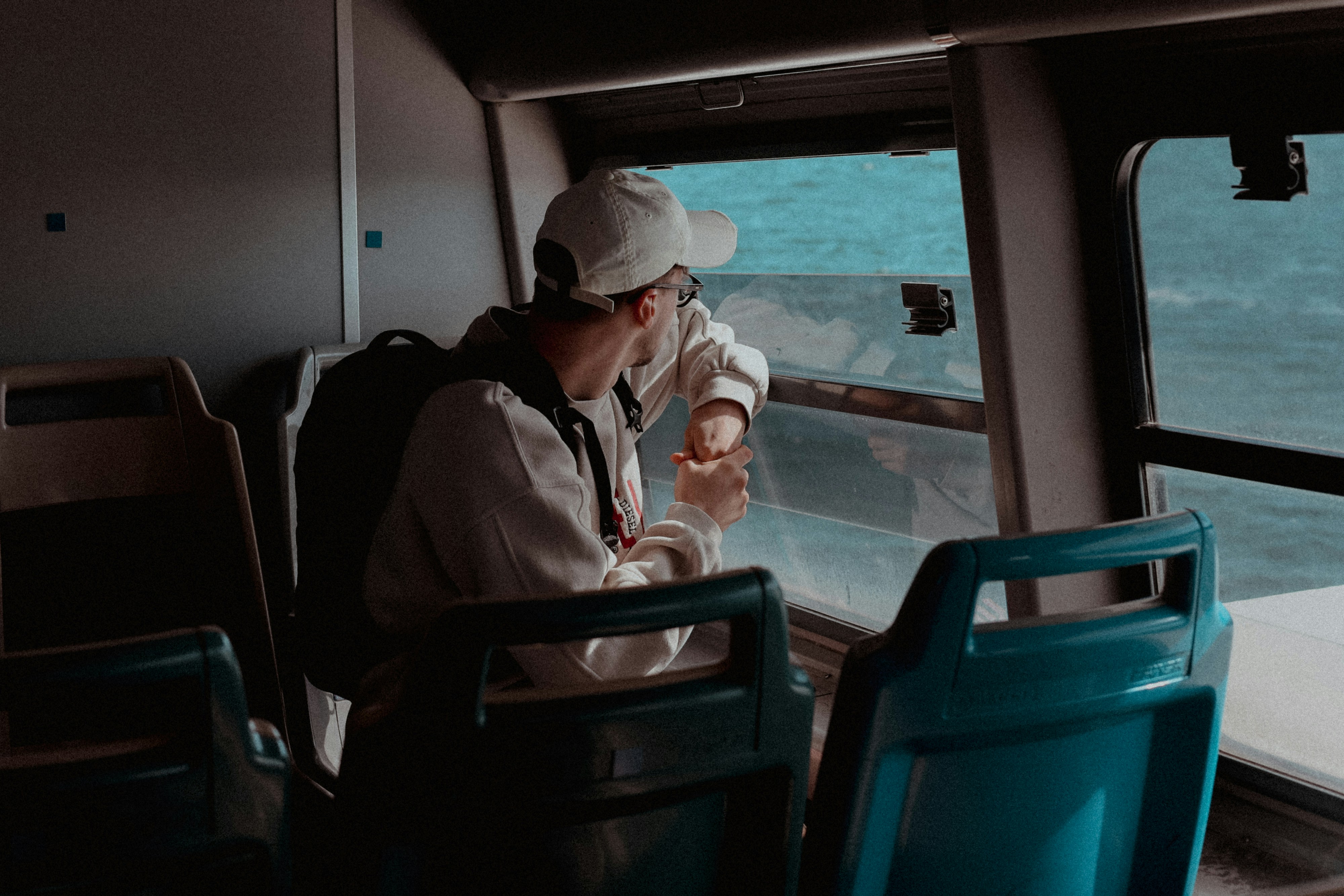 Cold Air, Warm Glance: A Passenger Engages the View Through Bus Windows