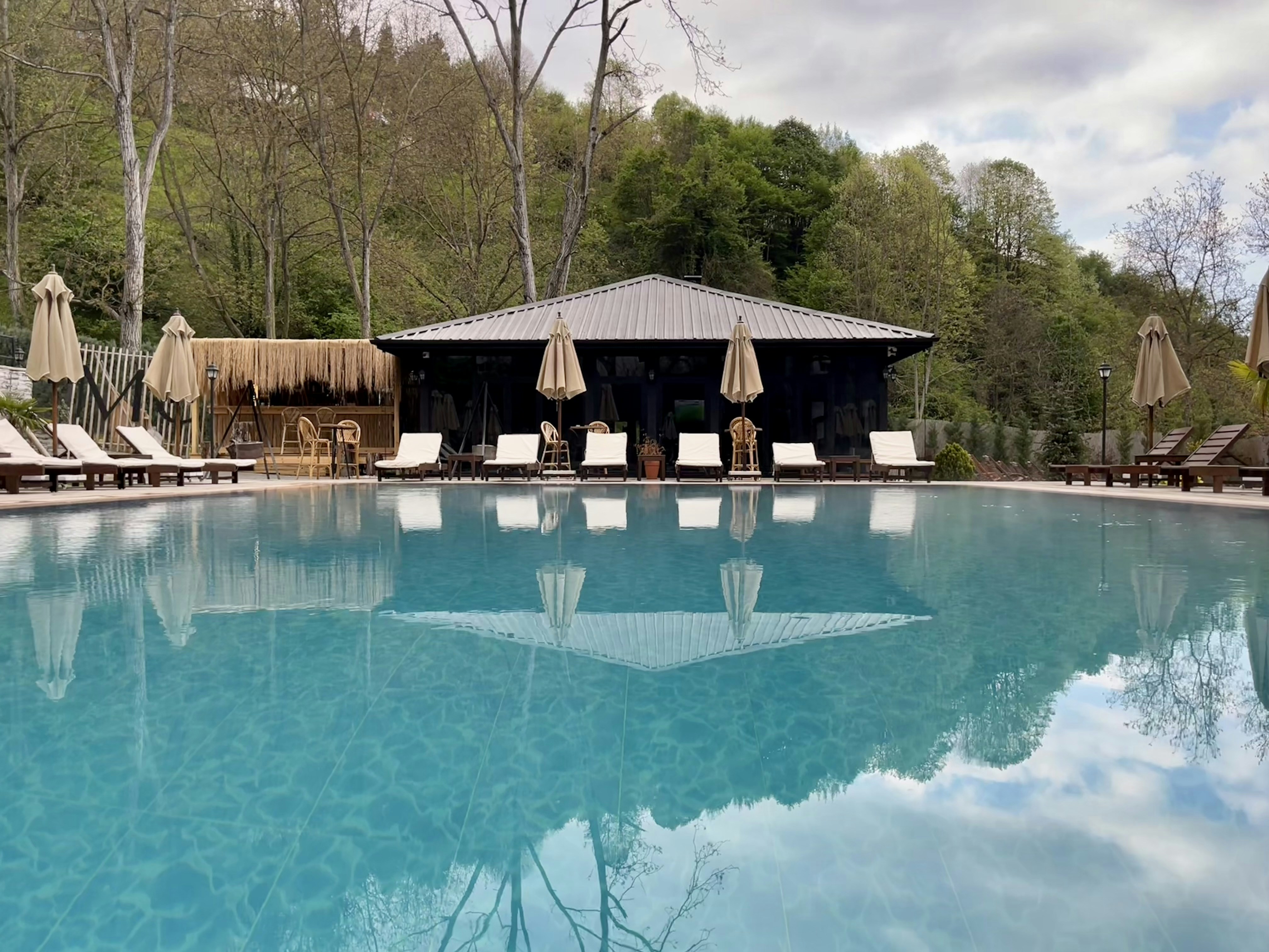 Poolside Pavilion Reflections: Symmetry and Calm