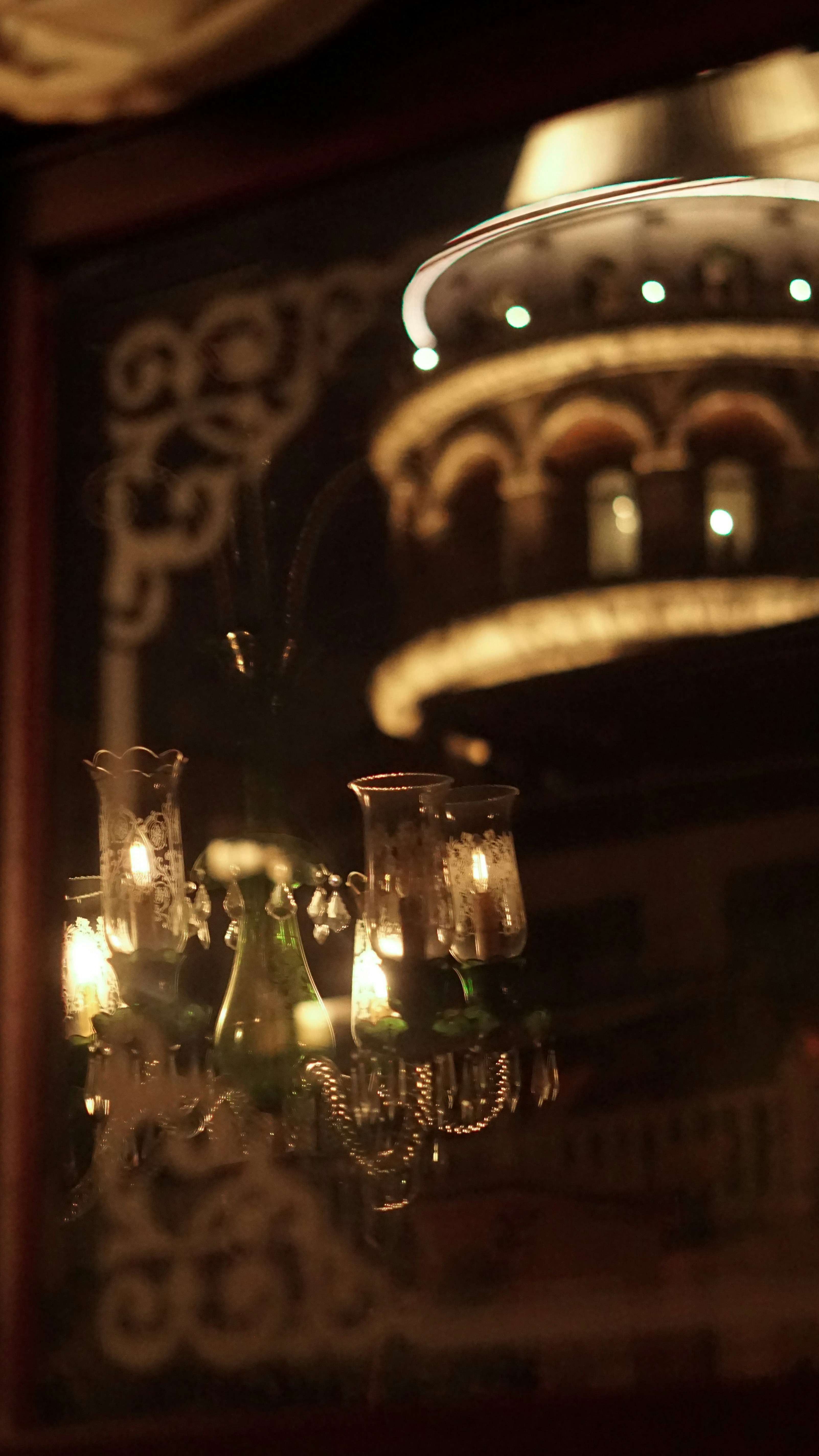 Amber Chandelier Echo in a Night Window