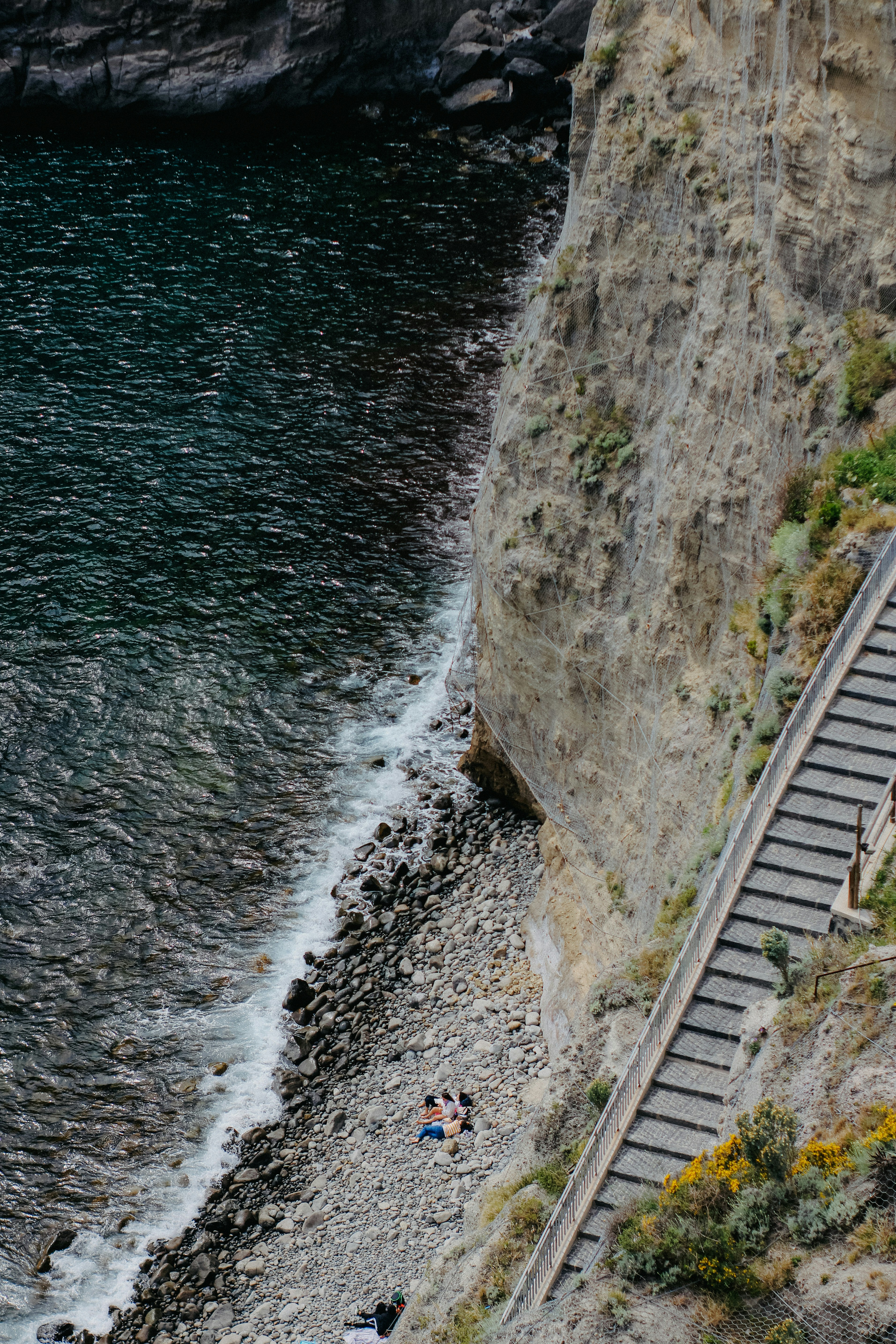Cliffside Staircase Over the Pebble Shore