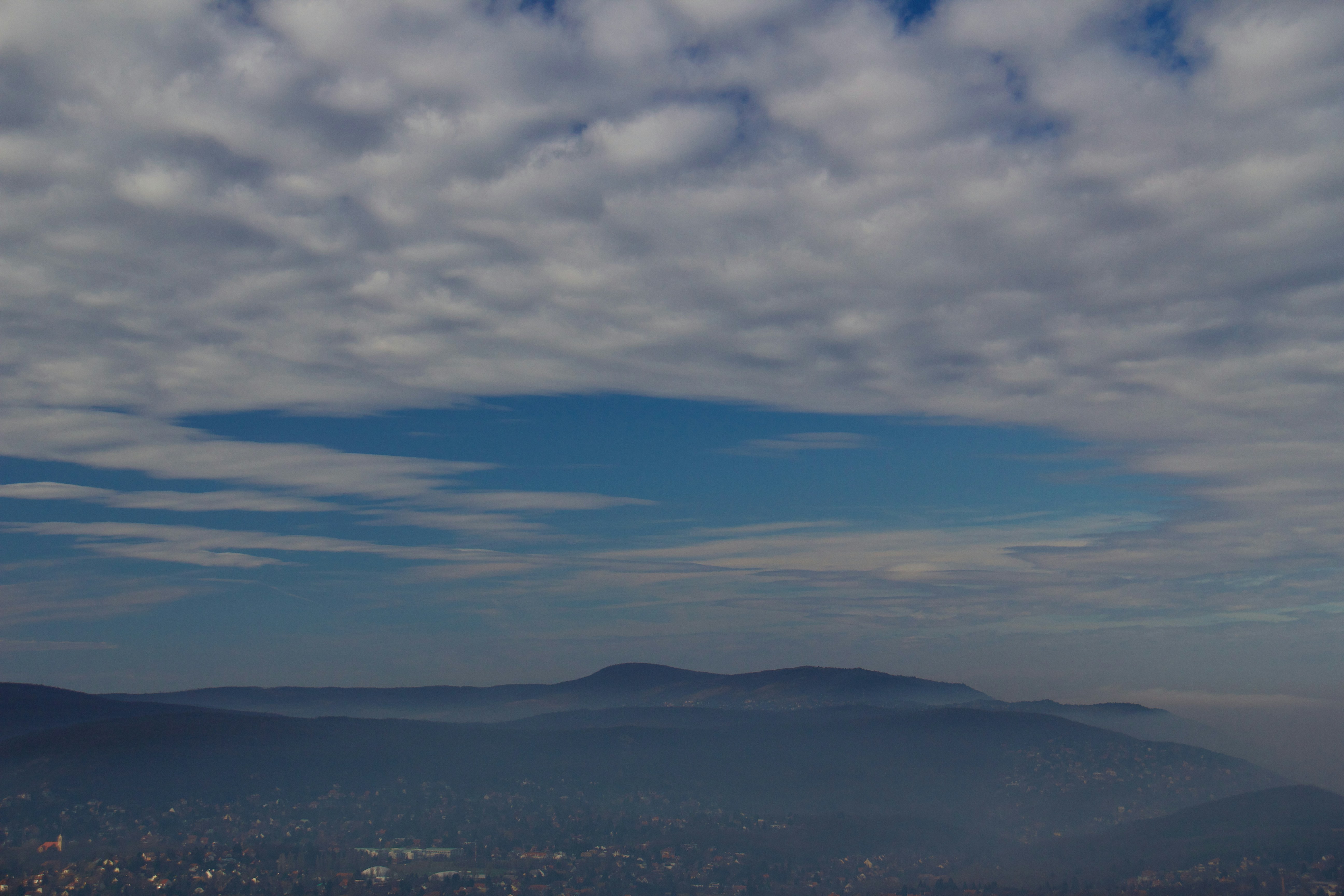 Winter noon time sky and clouds #5 - hole in the sky