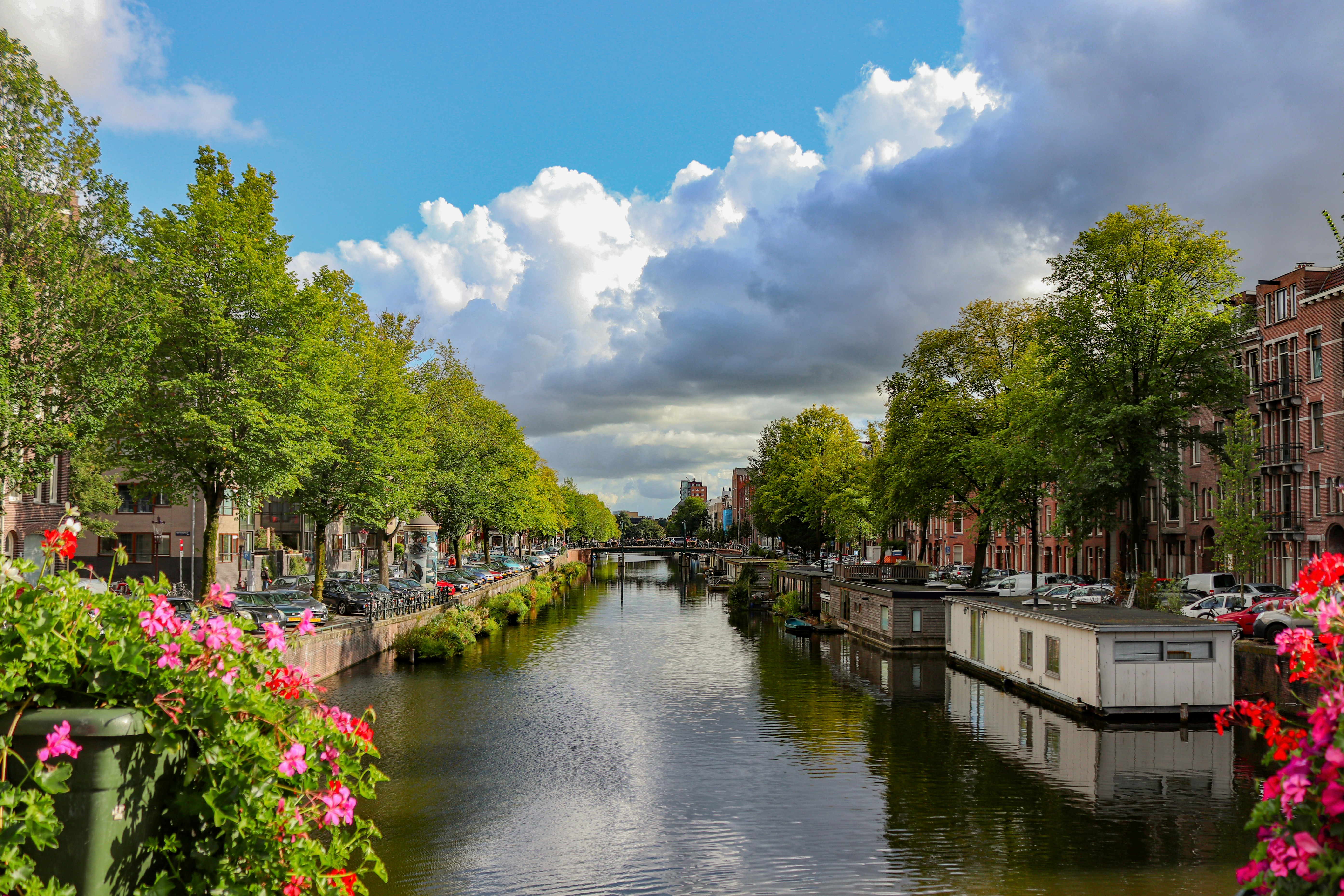 A river running through a city surrounded by tall buildings photo ...