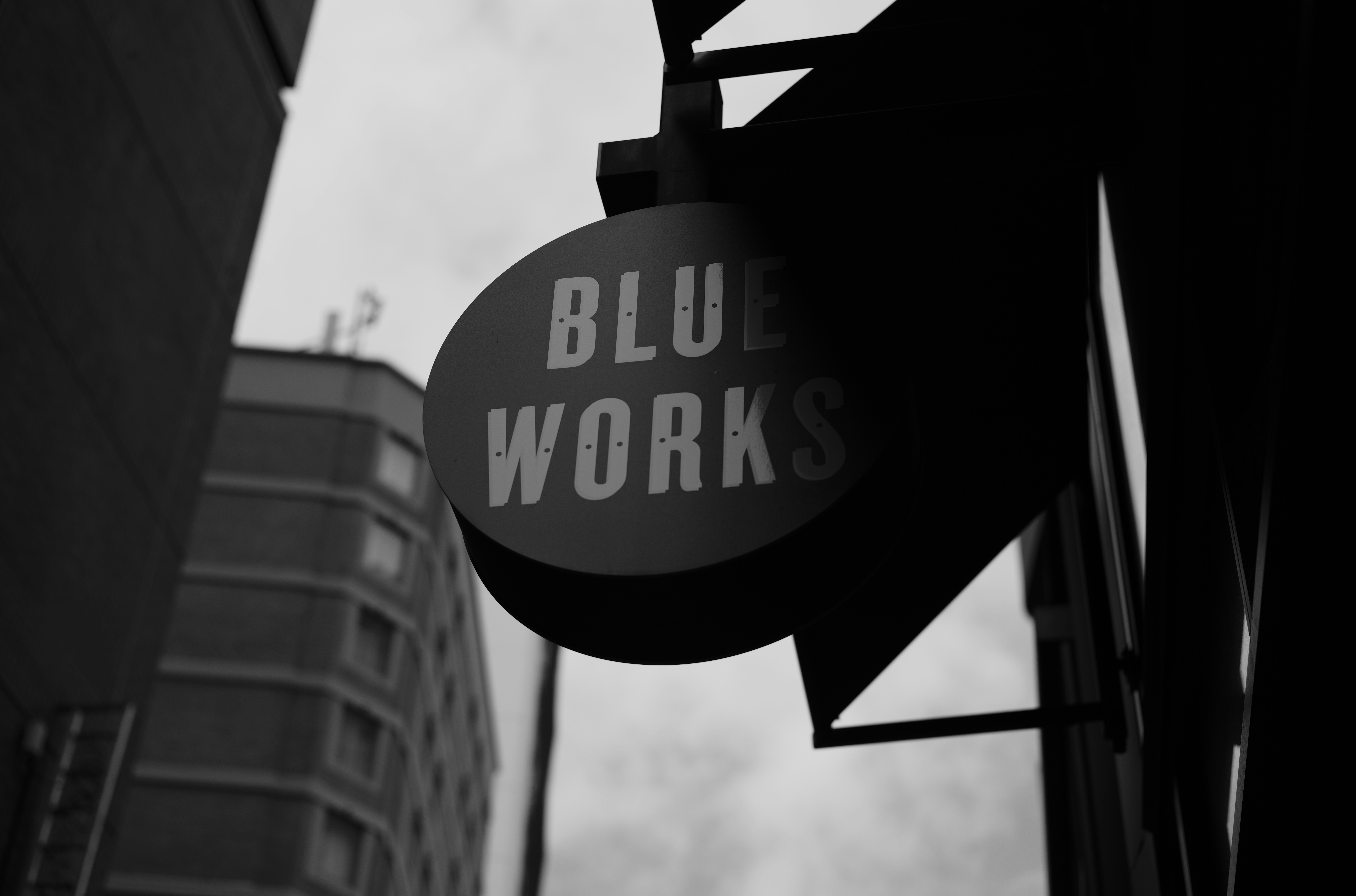A black and white photo of a blue works sign photo – Free City Image on ...