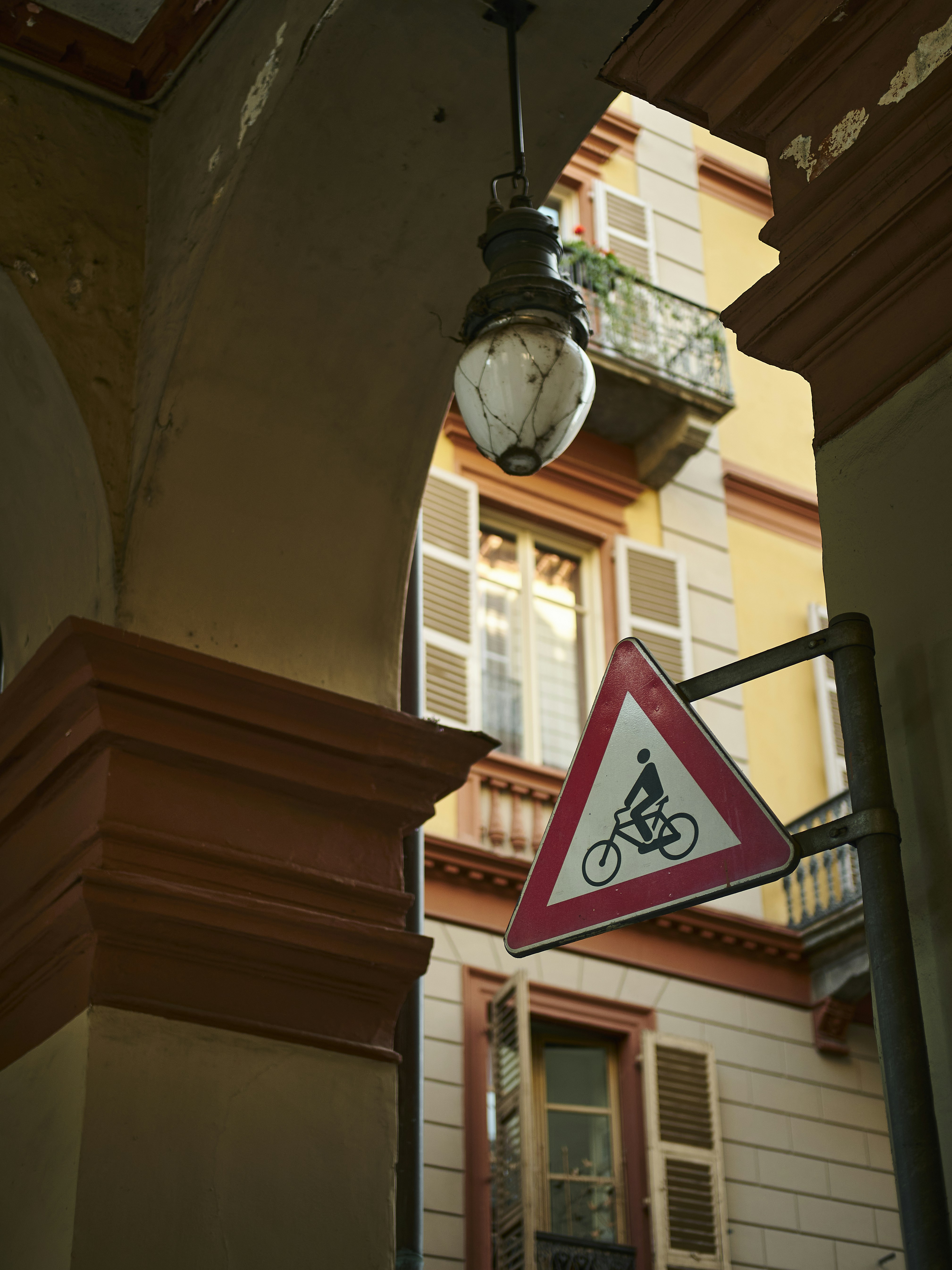 A street sign hanging from the side of a building photo – Free City ...