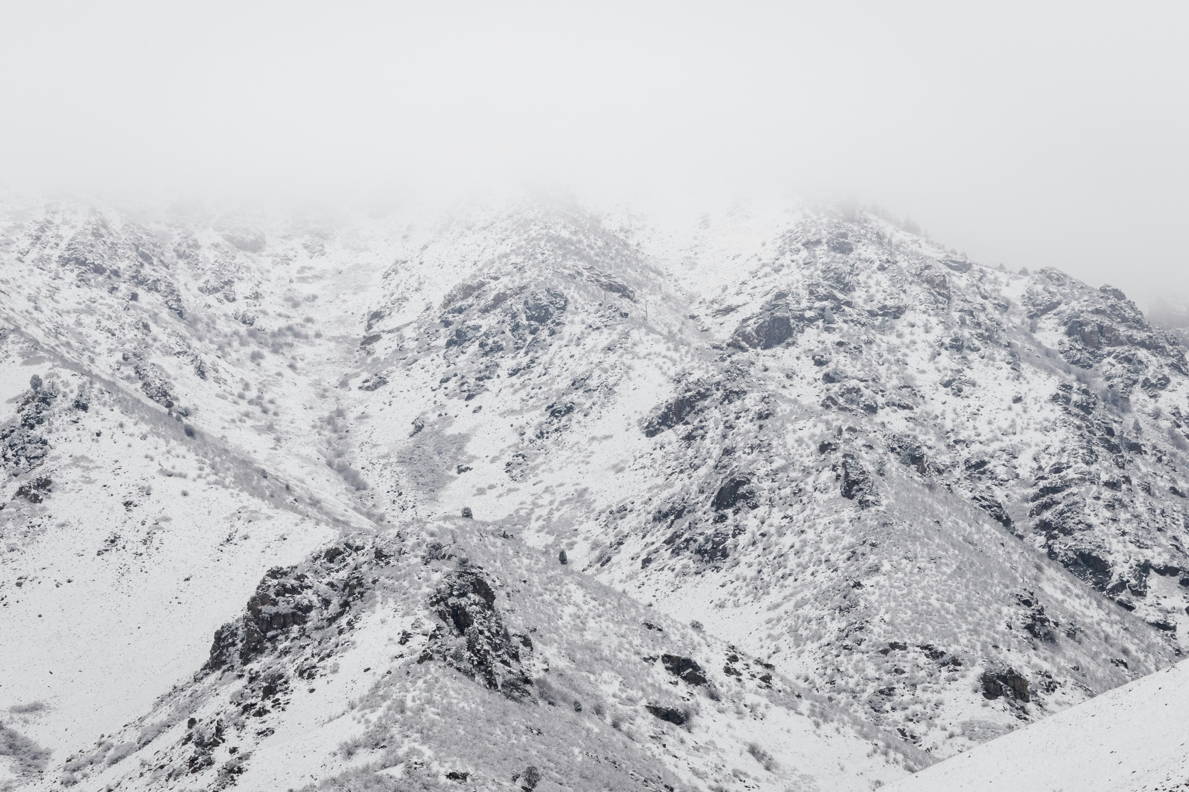 A mountain covered in snow with a sky background photo – Free Mountans ...
