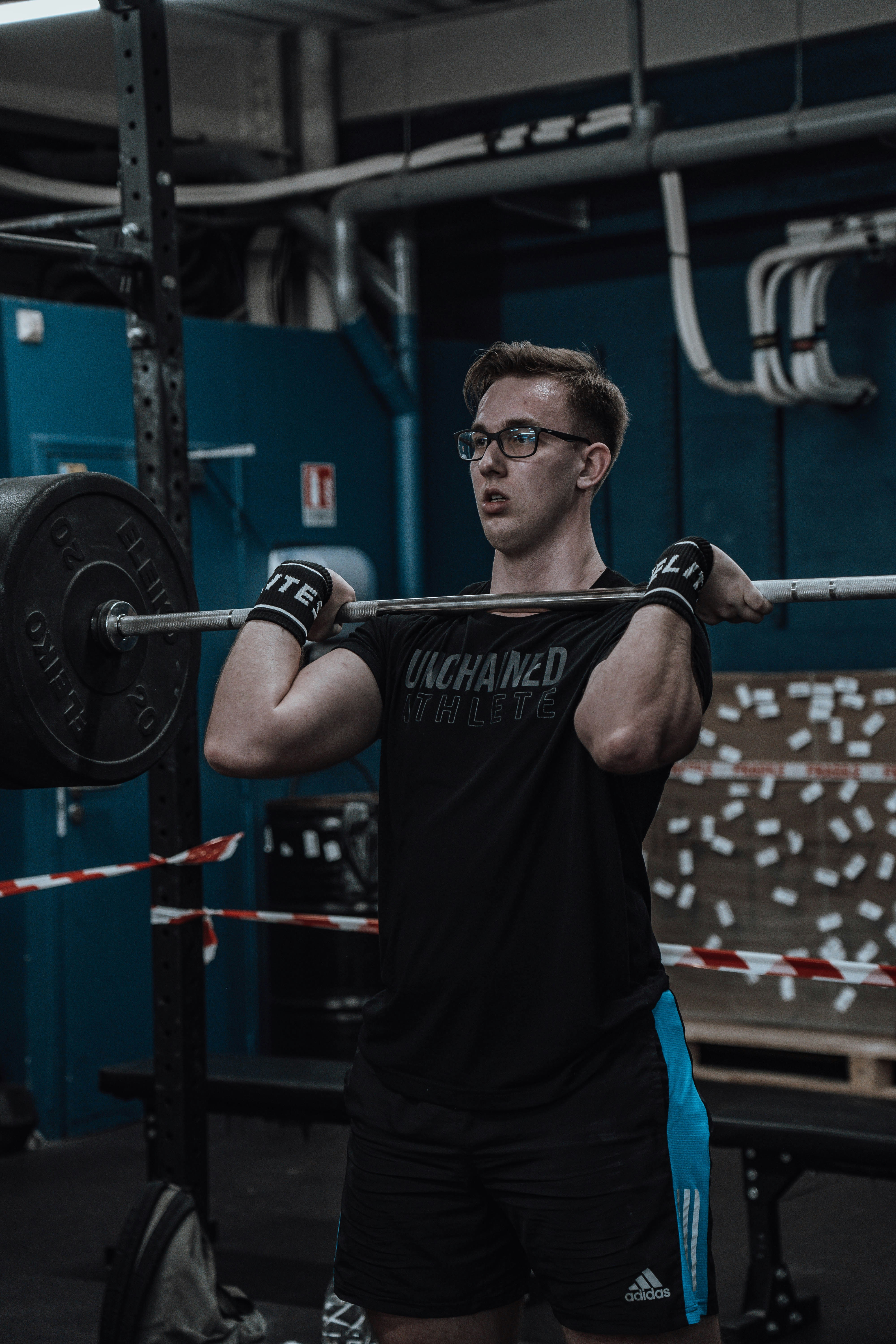 A man holding a barbell in a gym photo – Free Fitness Image on Unsplash