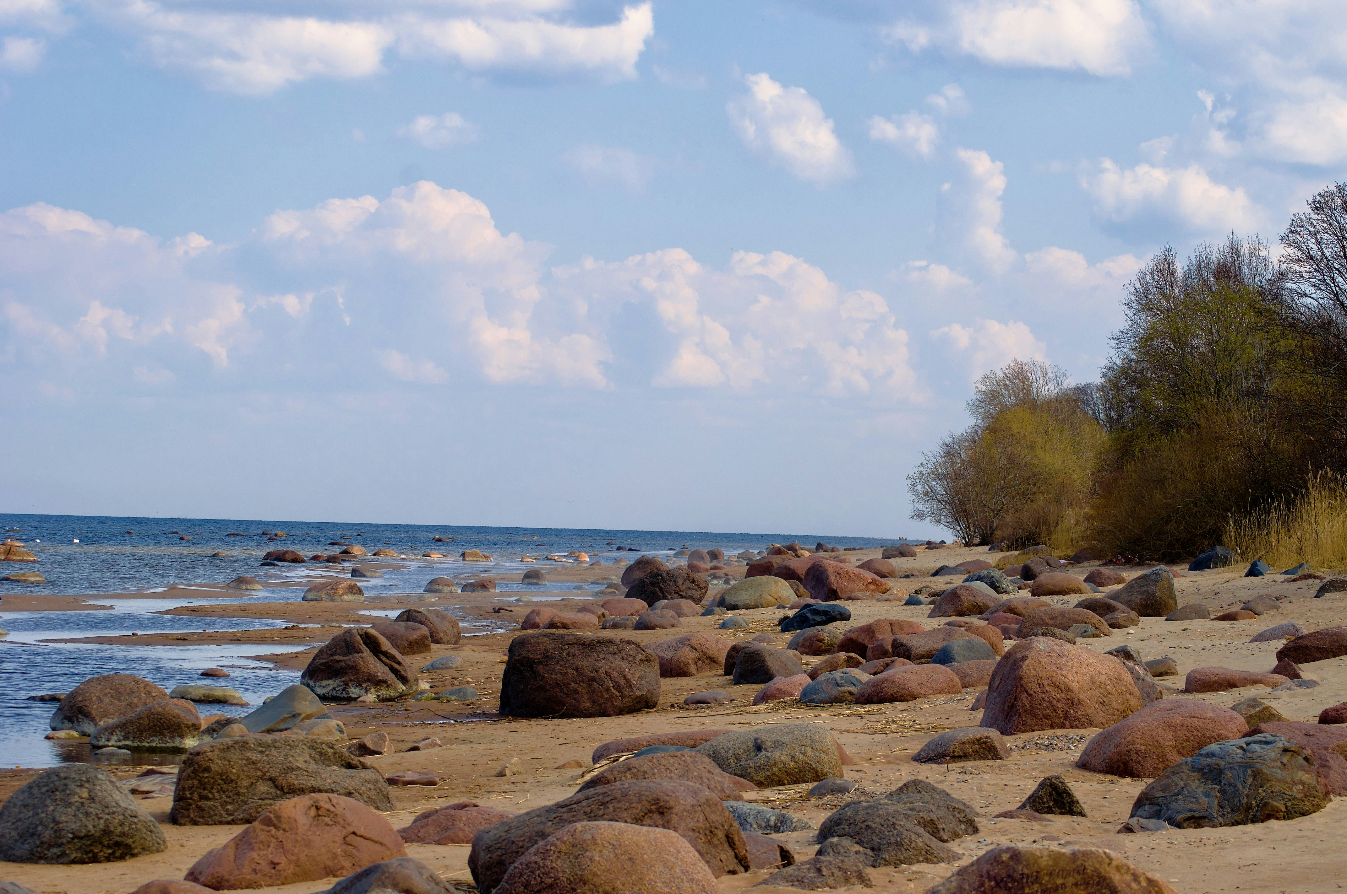 Rocky Beach Saka | a beach with large rocks and a body of water