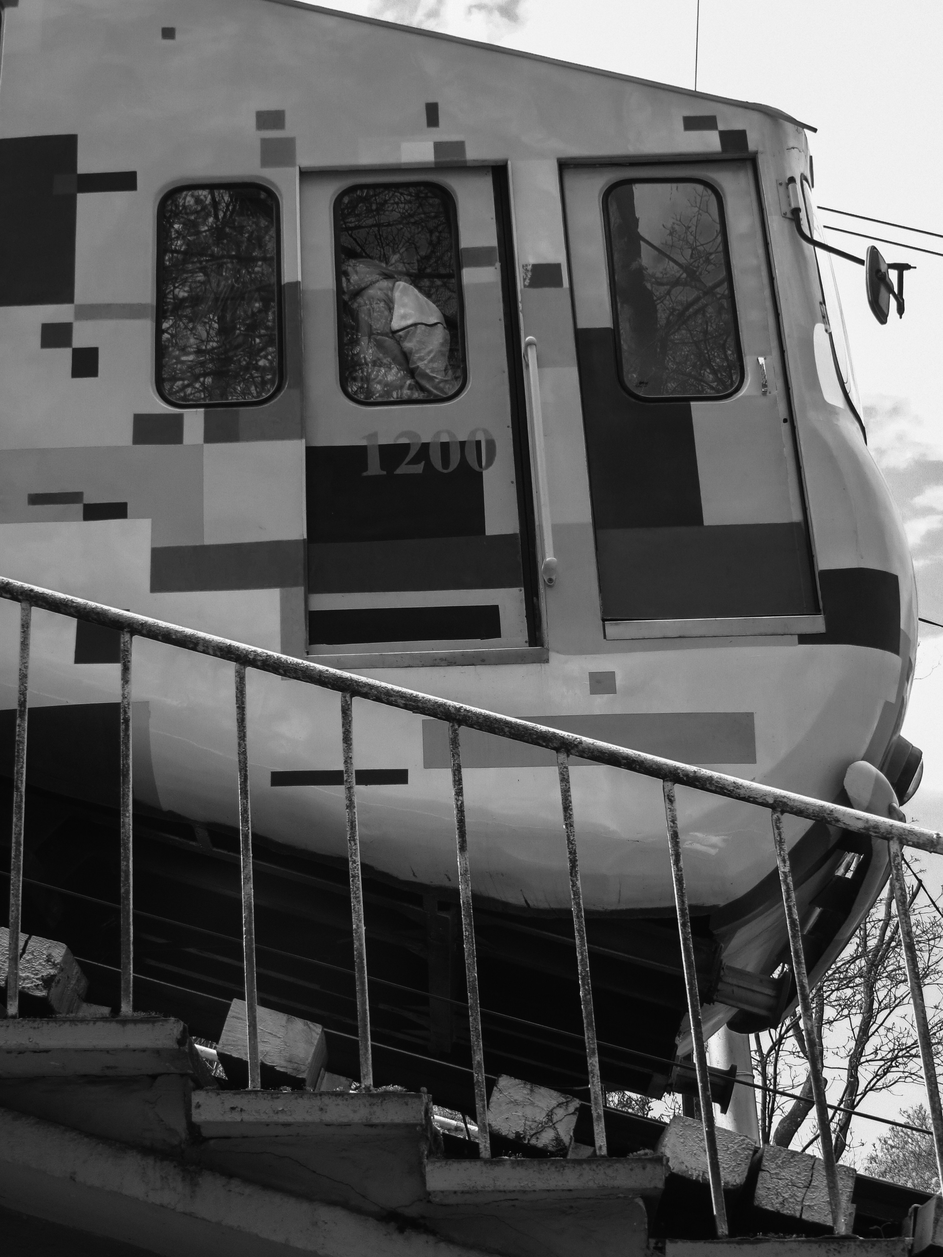 Angled Front End of a Graffiti-Patterned Train in Monochrome