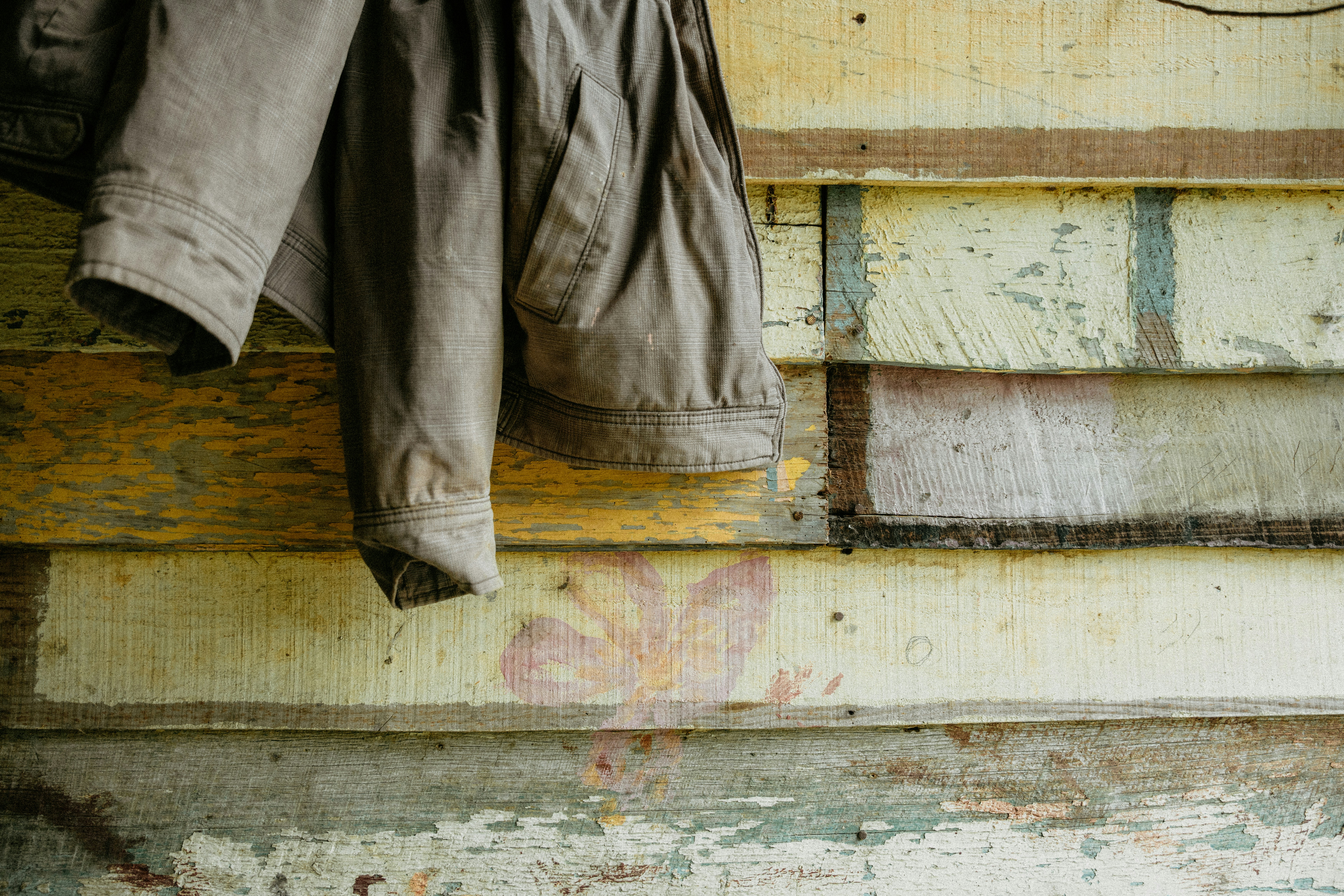 Weathered Jacket on Faded Planks: A Quiet Still-Life