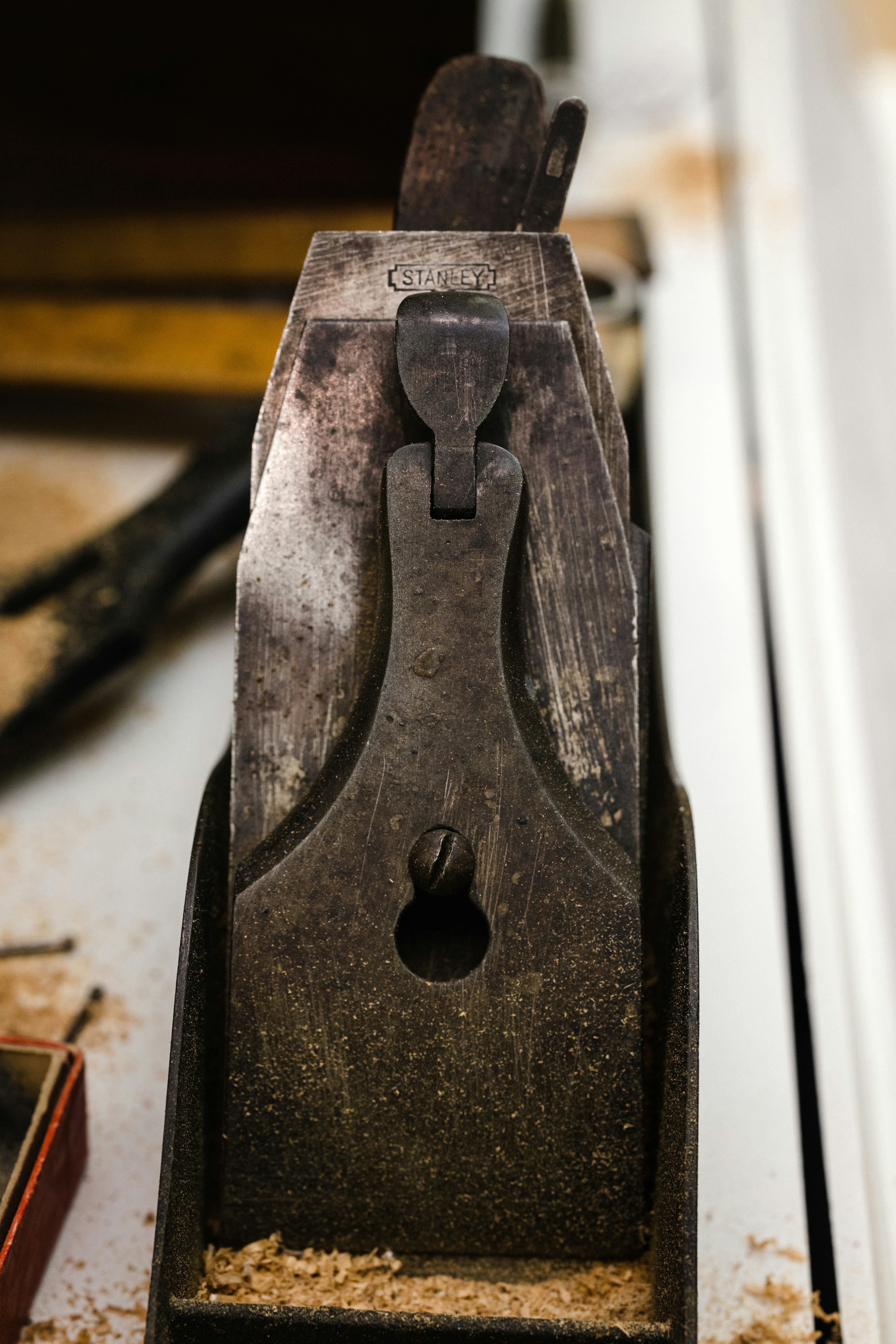 Dust-Laced Stanley Plane in a Quiet Workshop