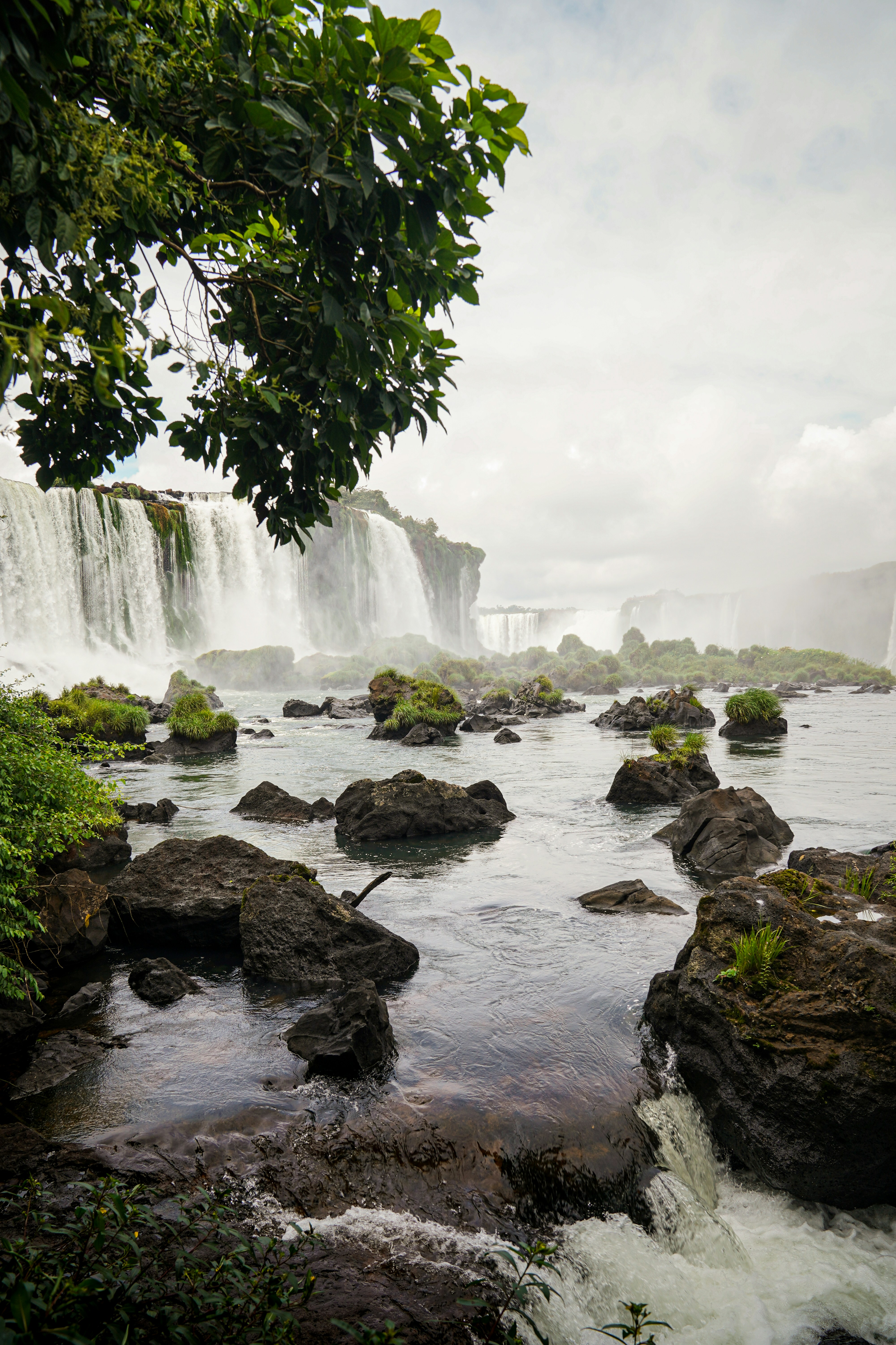 A large waterfall with lots of water coming out of it photo – Free ...