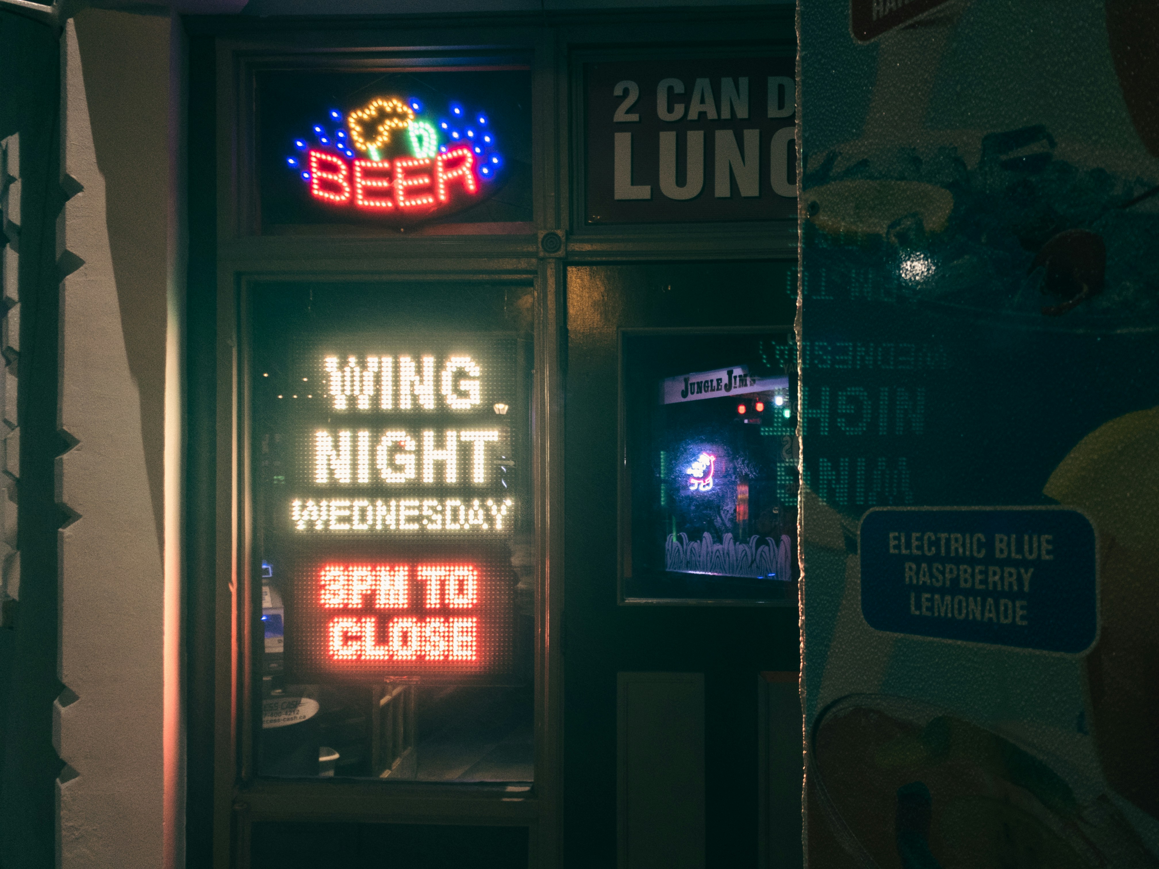 A neon sign that reads wing night wednesday photo – Free Building Image ...
