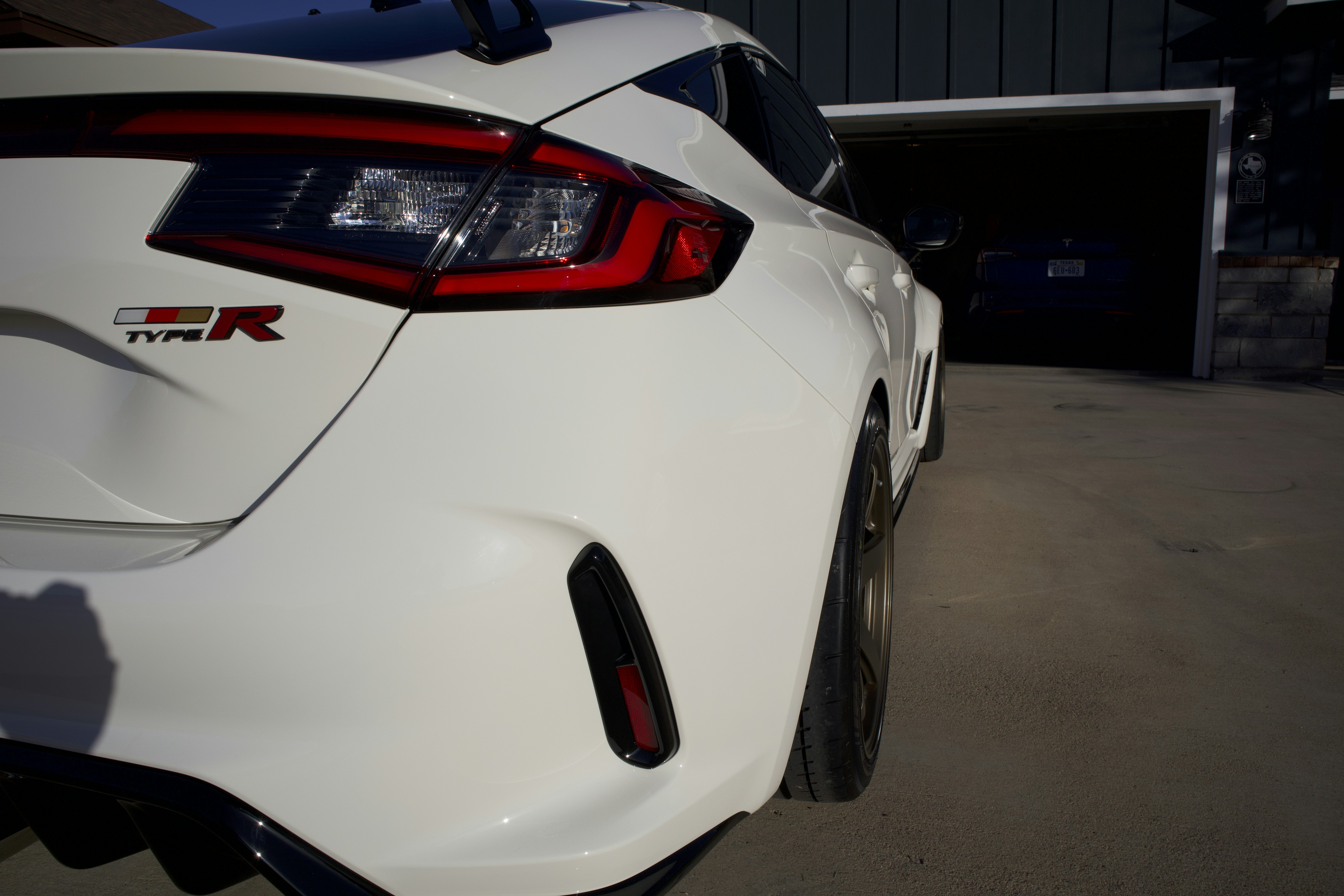 The rear end of a white car parked in a garage photo – Free #civictyper ...